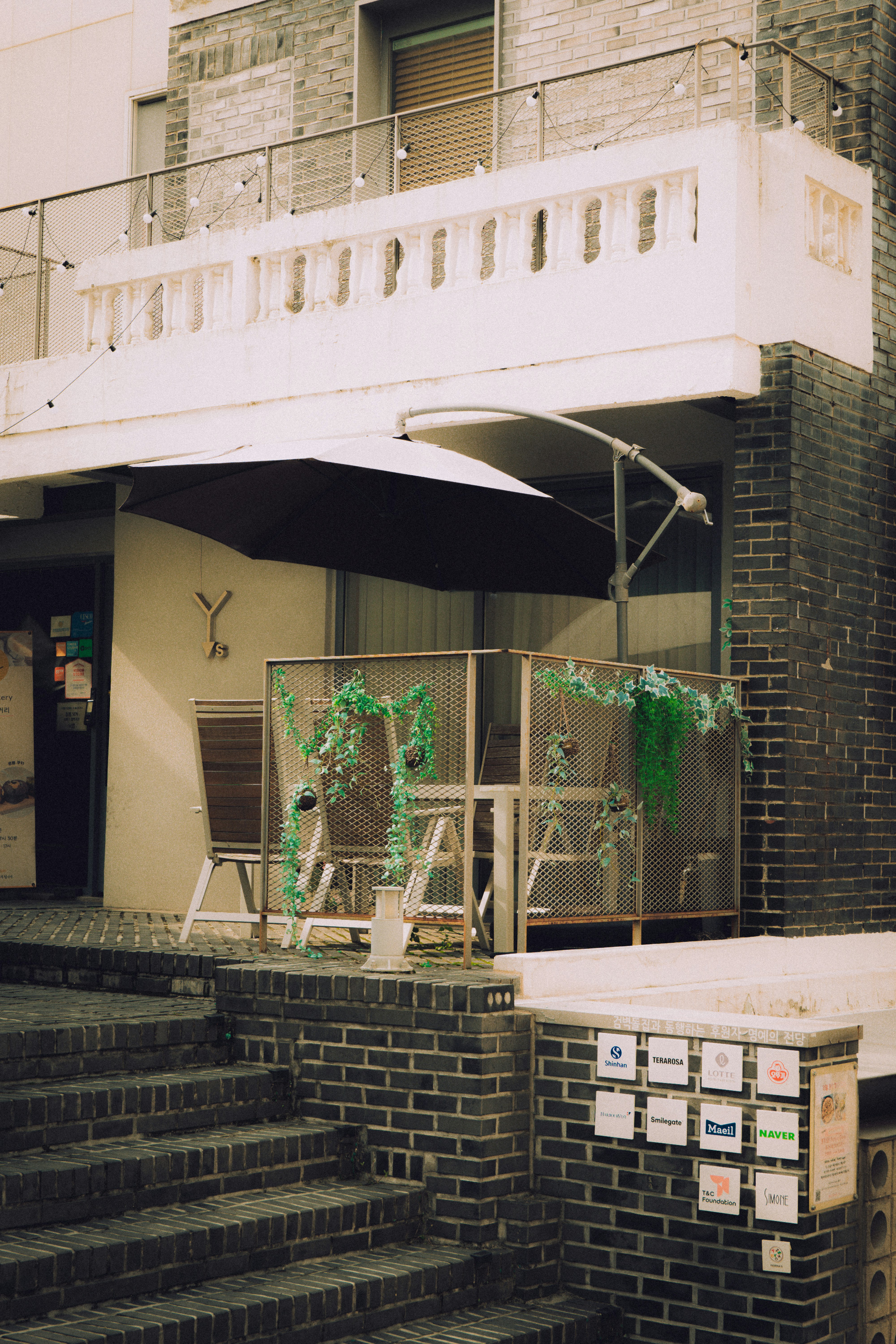 Exterior of a cafe with outdoor seating area.