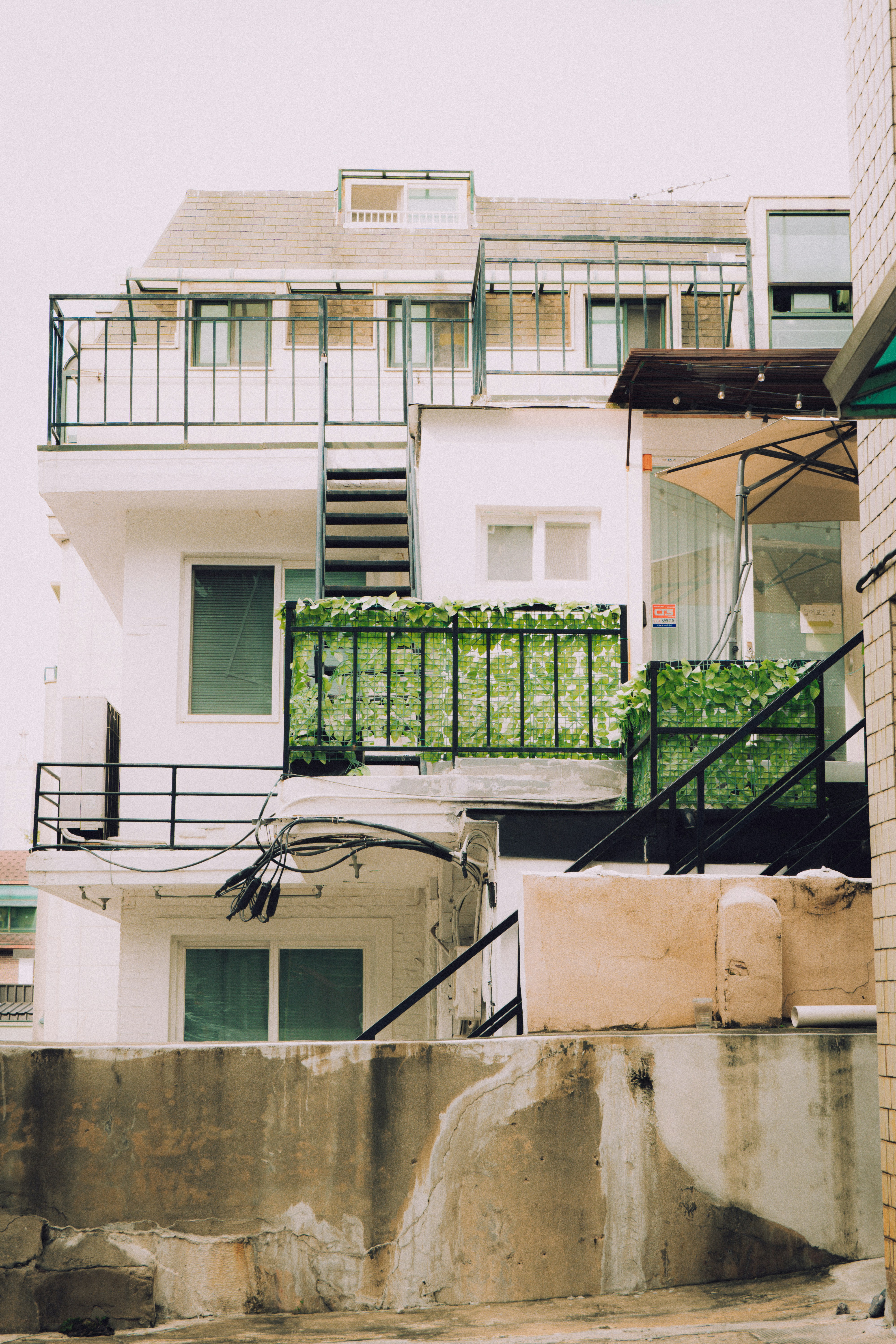 Apartment buildings with balconies and stairs.