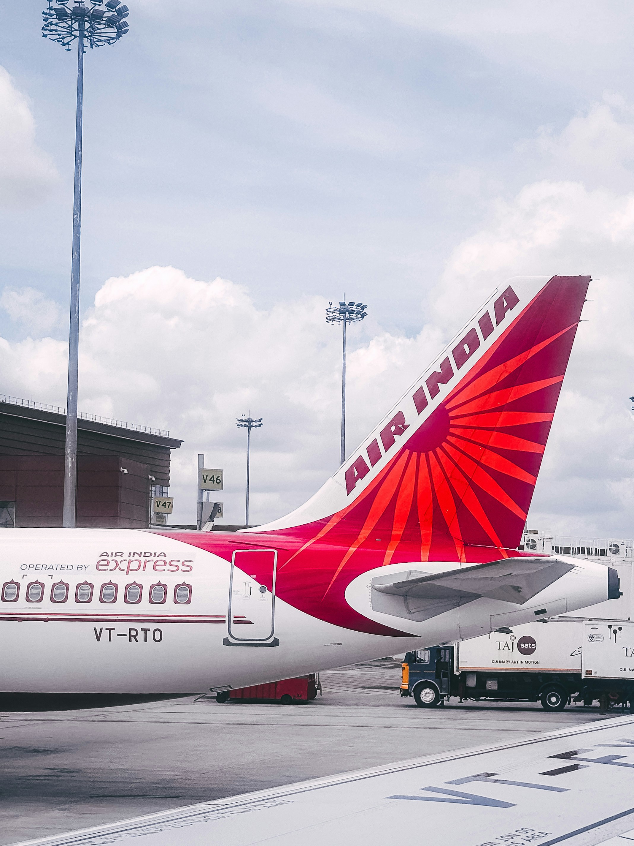 Tail of an Air India Airbus A320neo (Reg: VT-RTO) at Kempegowda Internatioal Airport (BLR) | Air india express airplane tail with logo at airport
