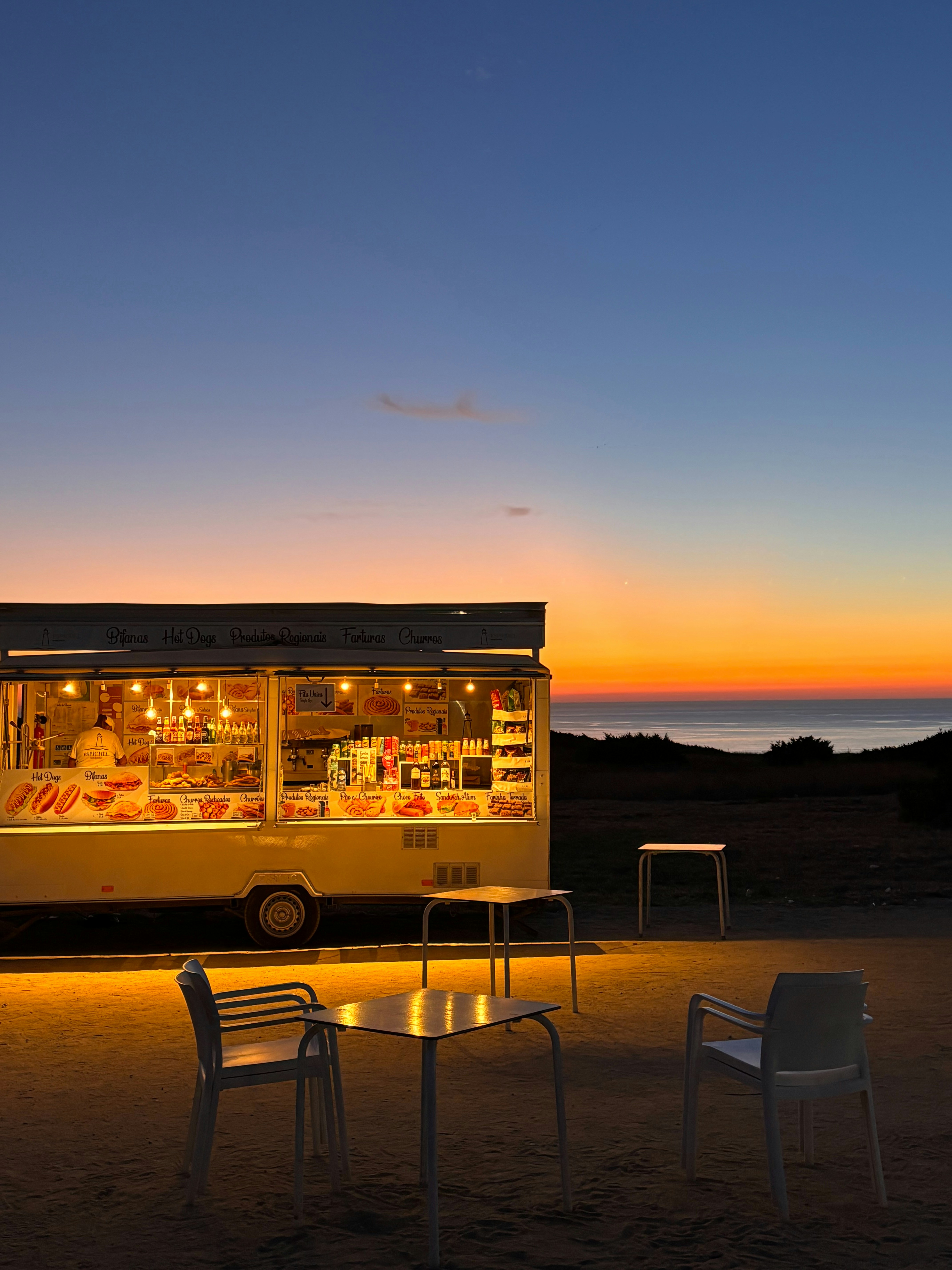 Tide's End Snack Wagon: Amber Glow on a Beach at Dusk