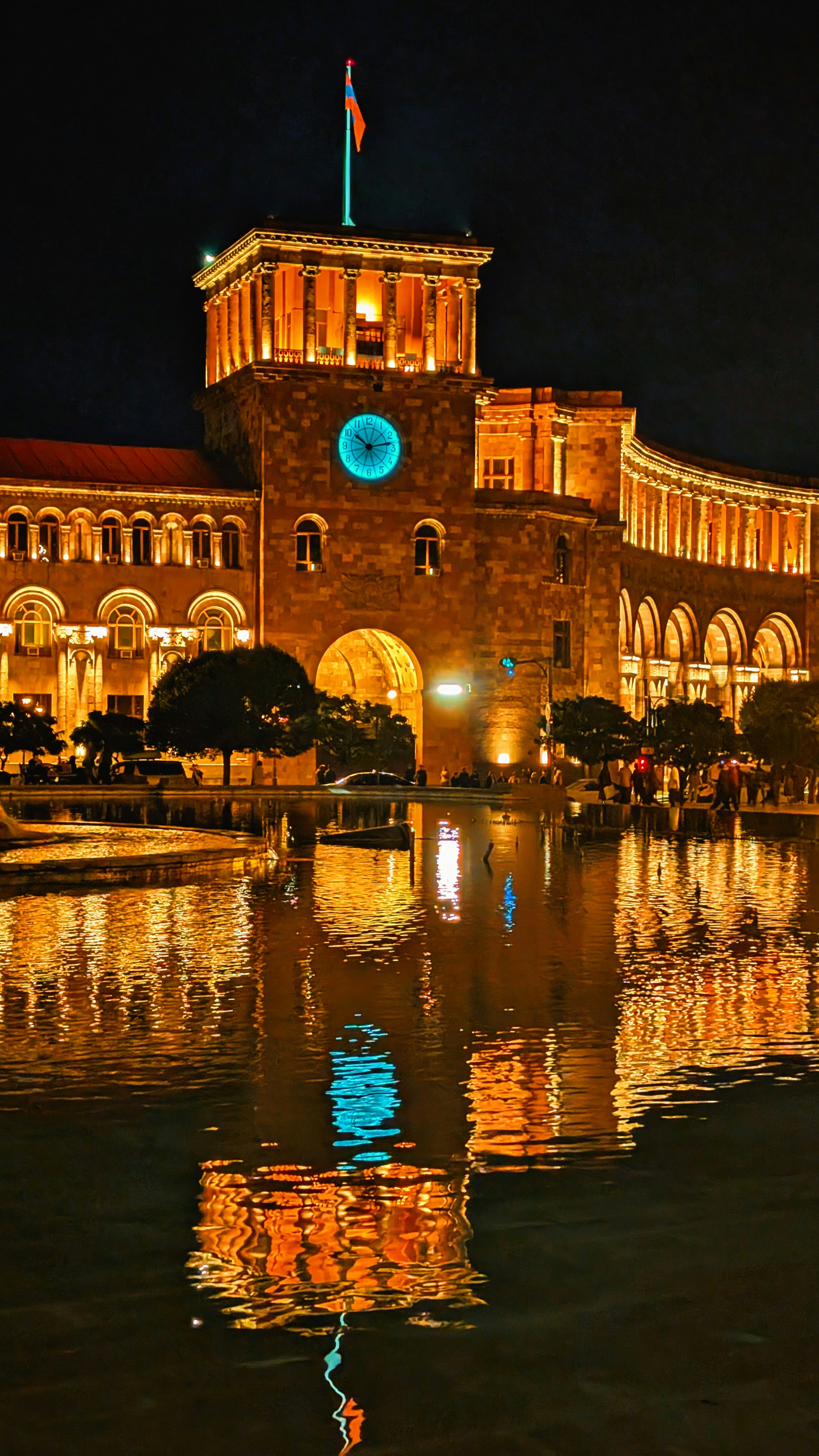Lit building and reflection at night