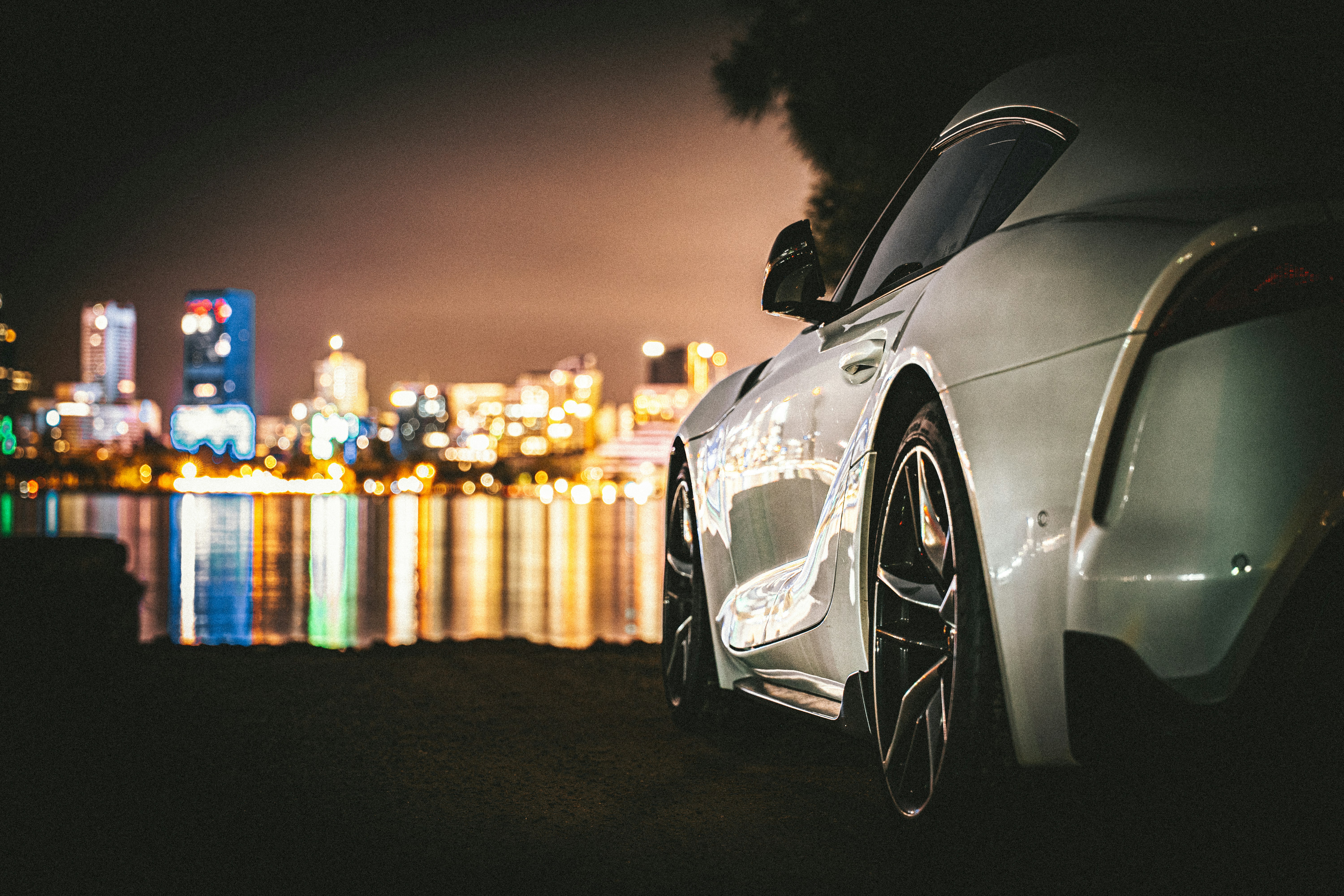 Urban Reflections: The Nighttime Elegance of a Sports Car