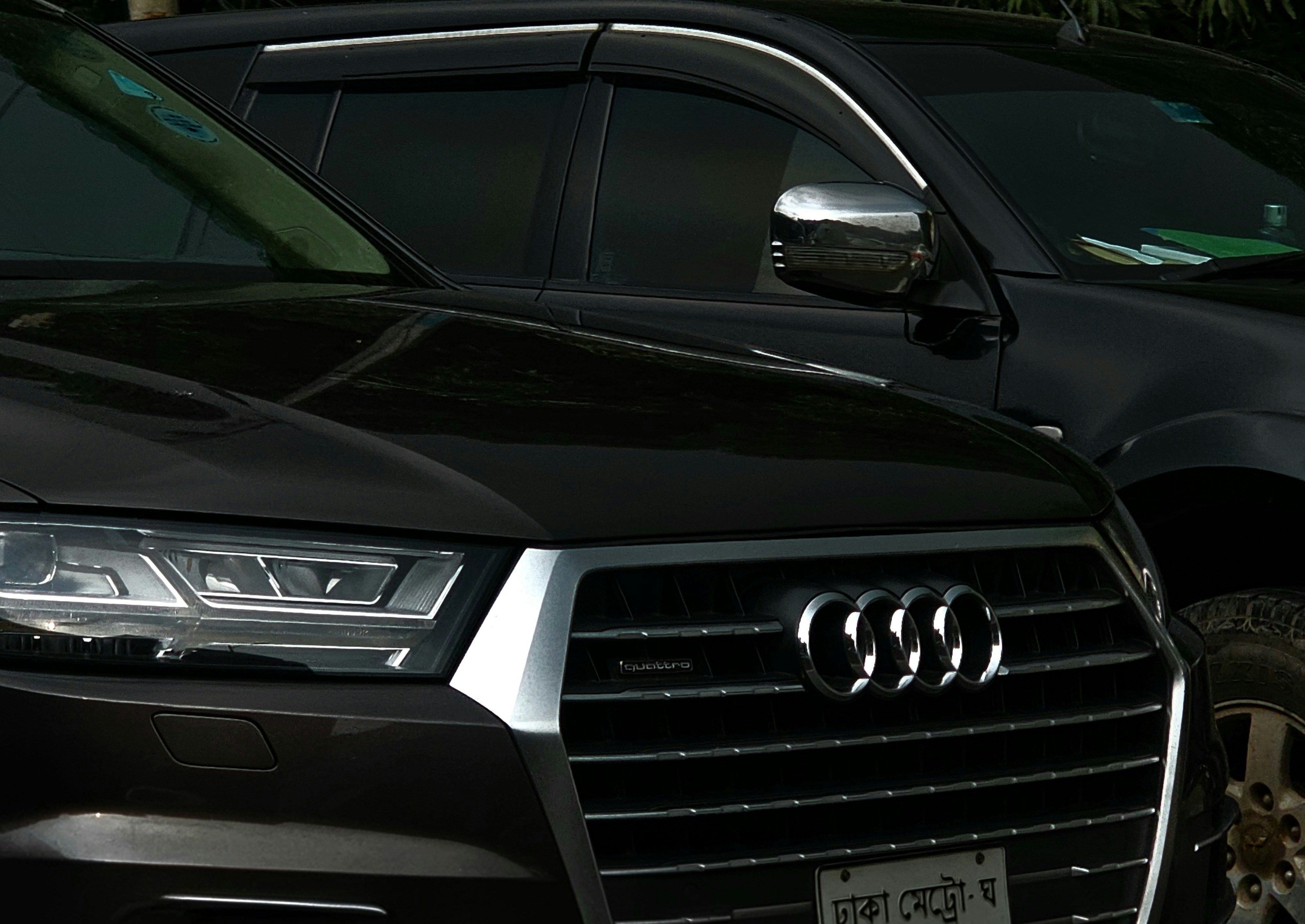 Two cars parked side by side