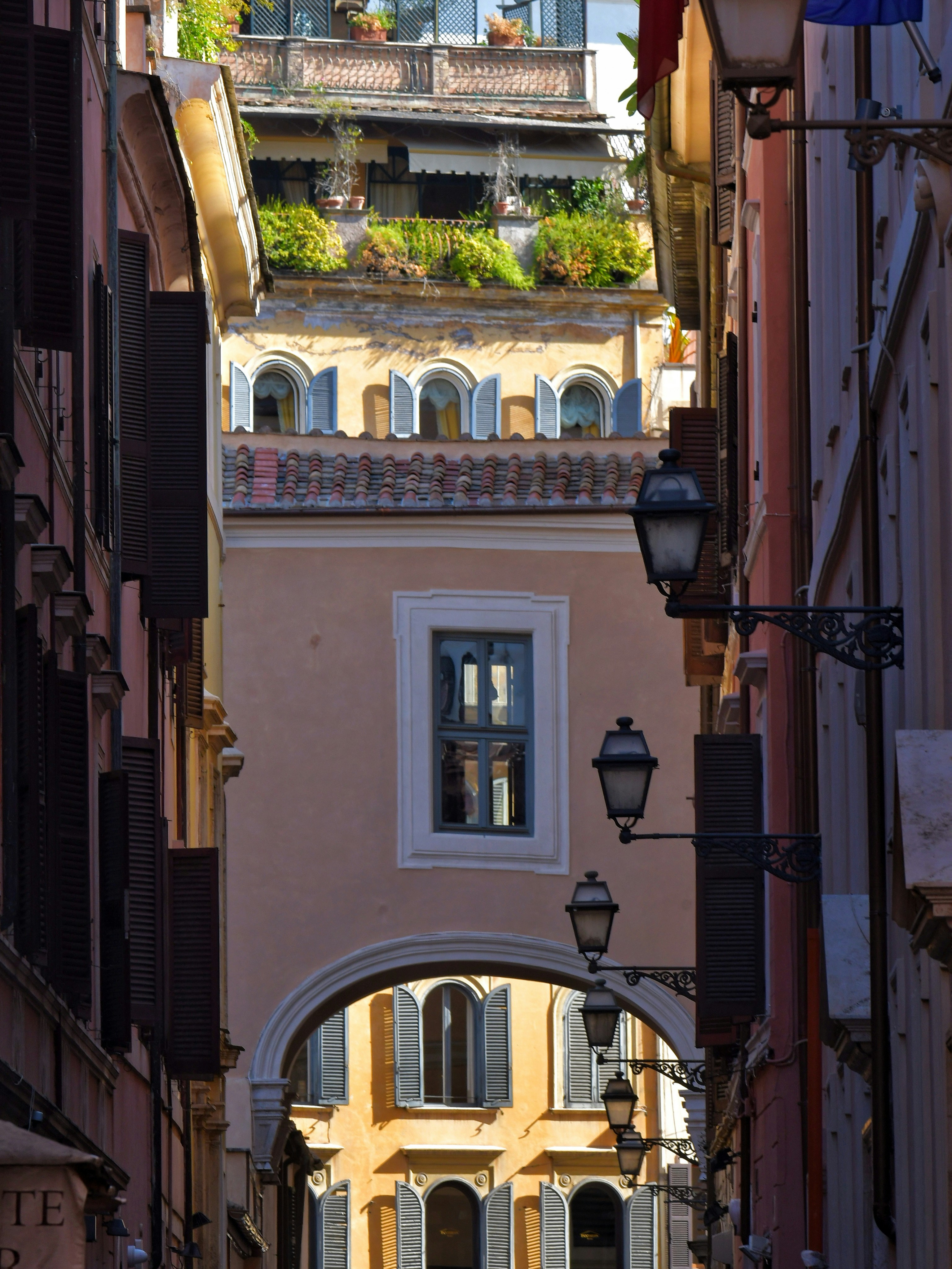 Archway and buildings in a narrow european street.