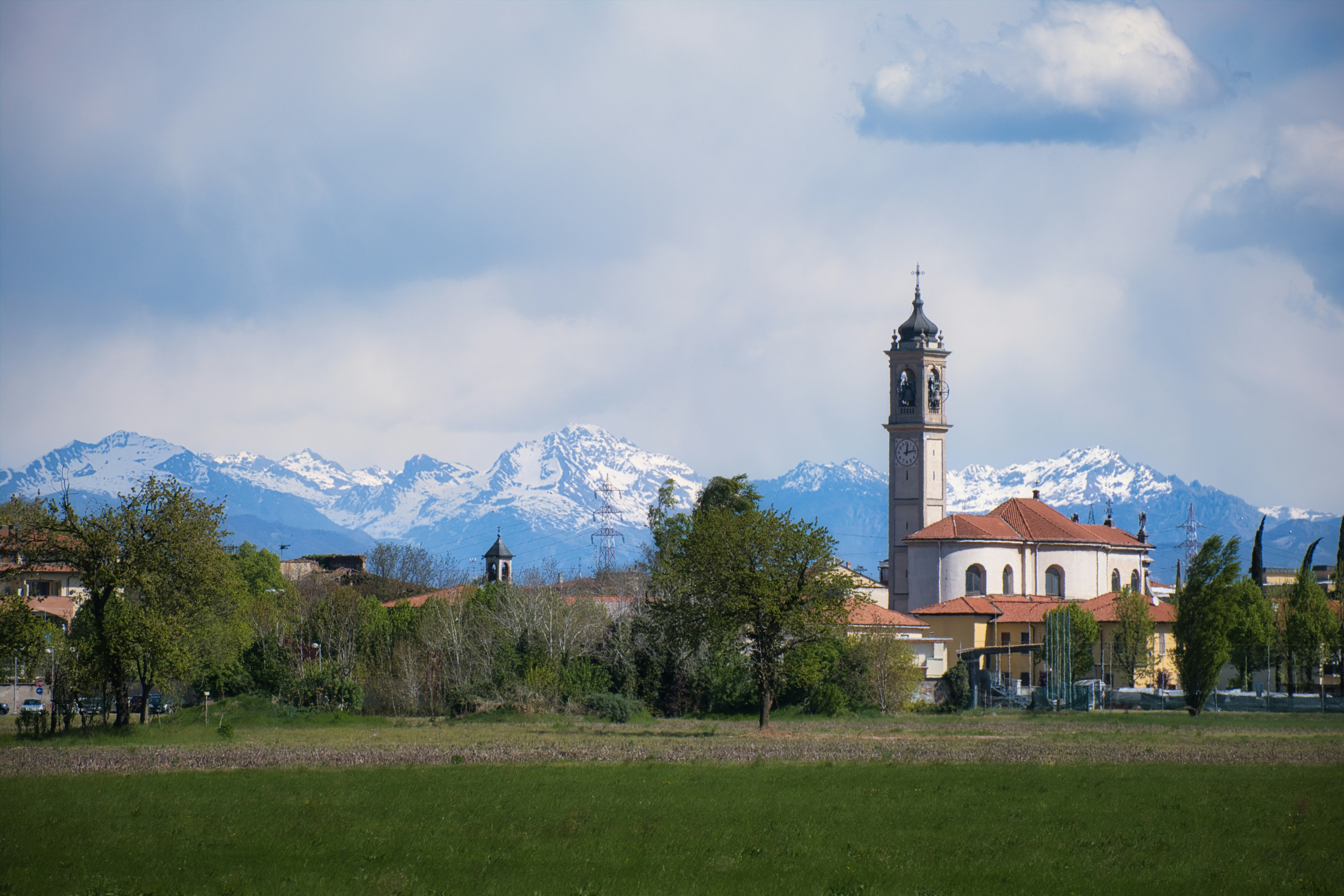 Clock Tower Crest: Riverside Village Beneath Snowbound Peaks