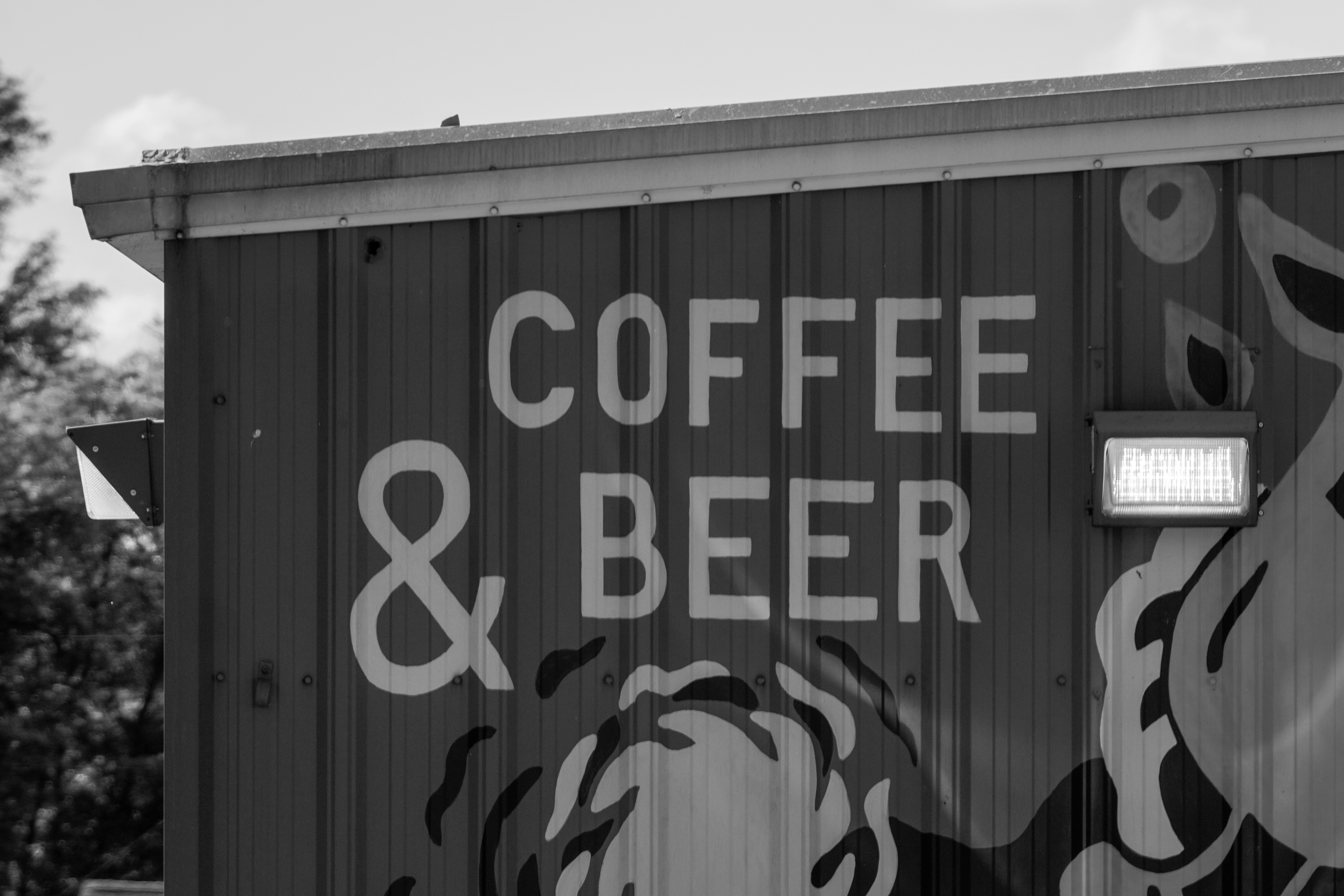 Sign says coffee and beer on a building