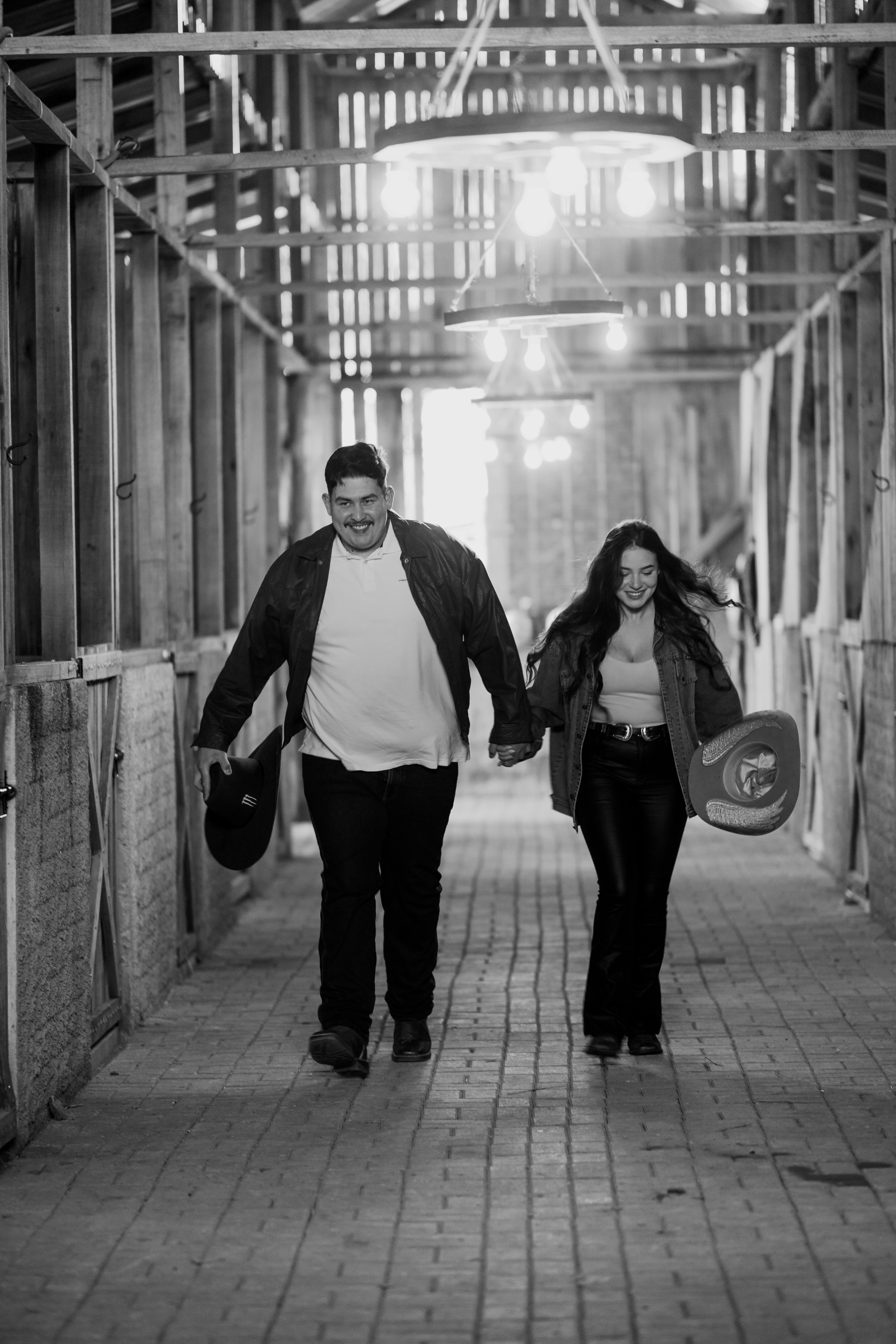 Hand in Hand Through a Lantern-Lit Wooden Arcade