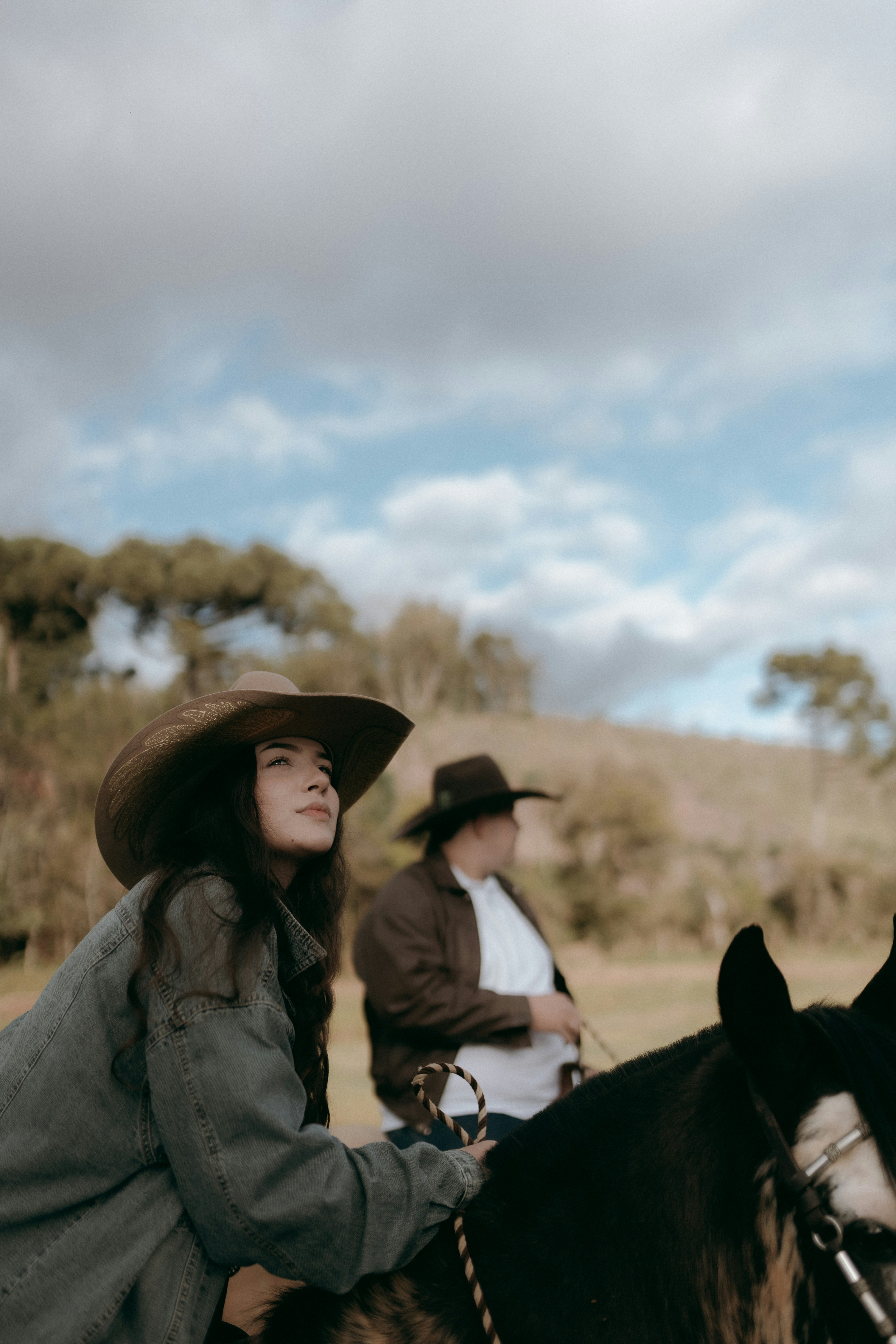 Soft Light, Wide Hat: A Quiet Moment with Rider and Horse