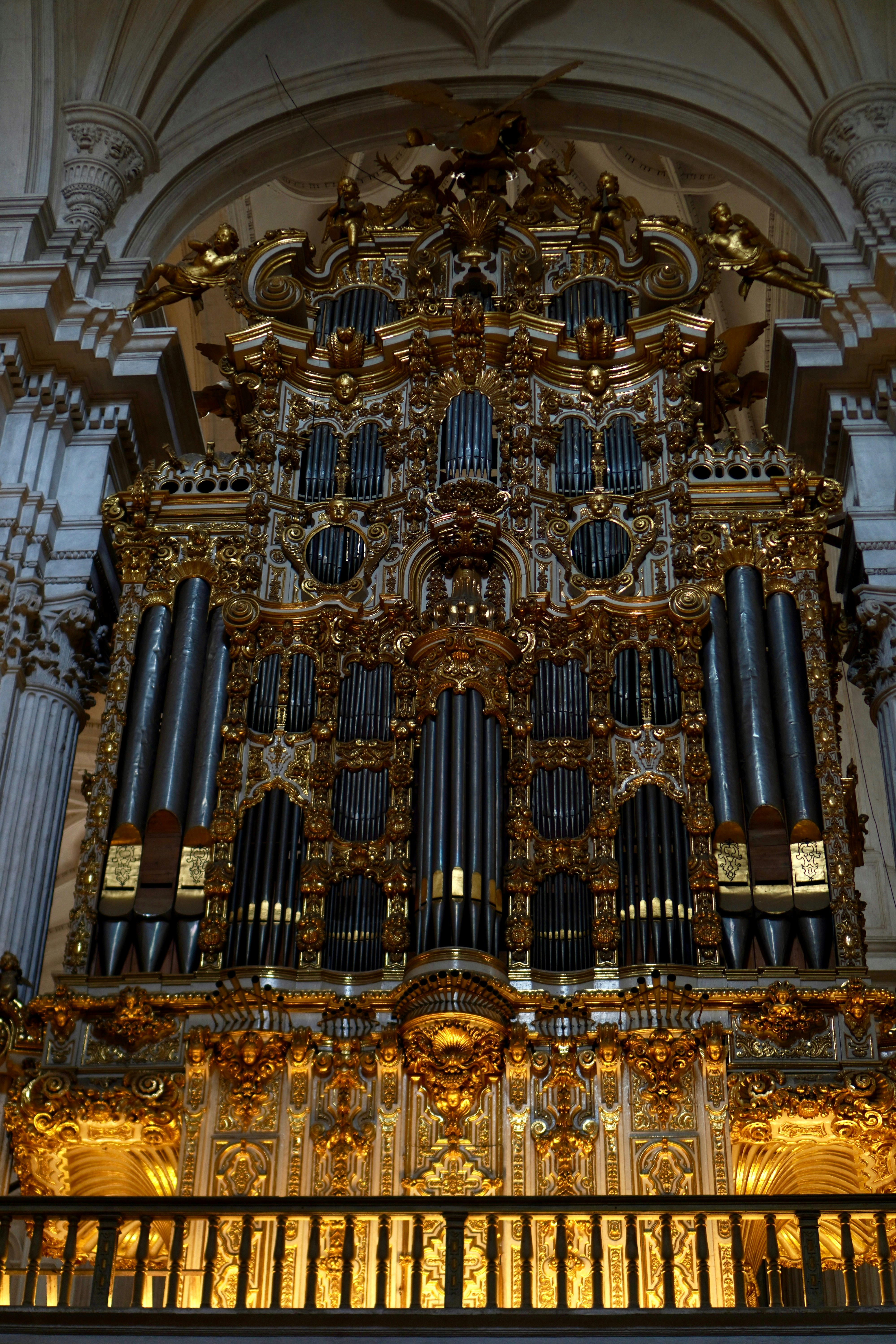 Ornate golden pipe organ inside a grand cathedral