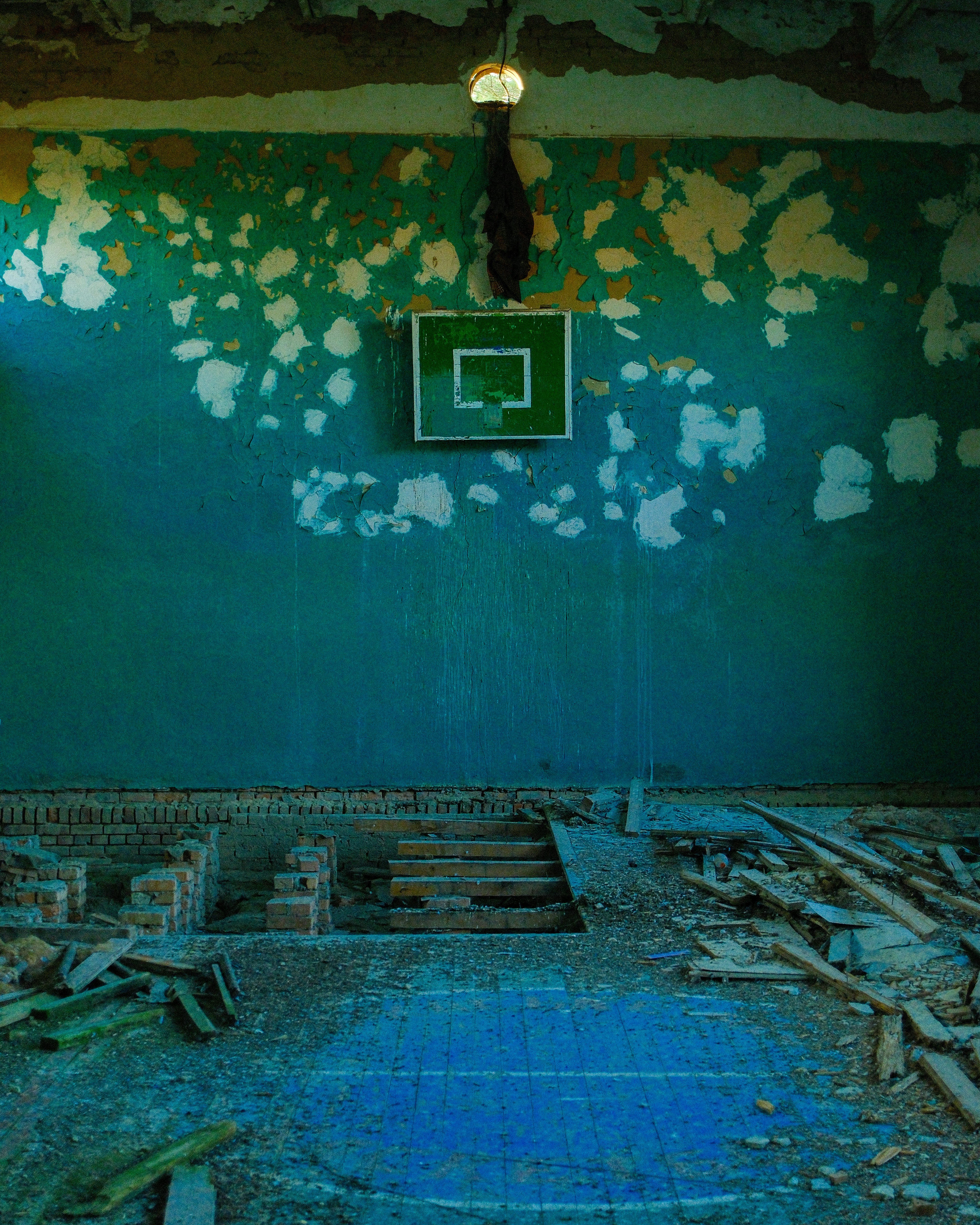 Teal Ruin: The Silent Hoop in an Abandoned Gym