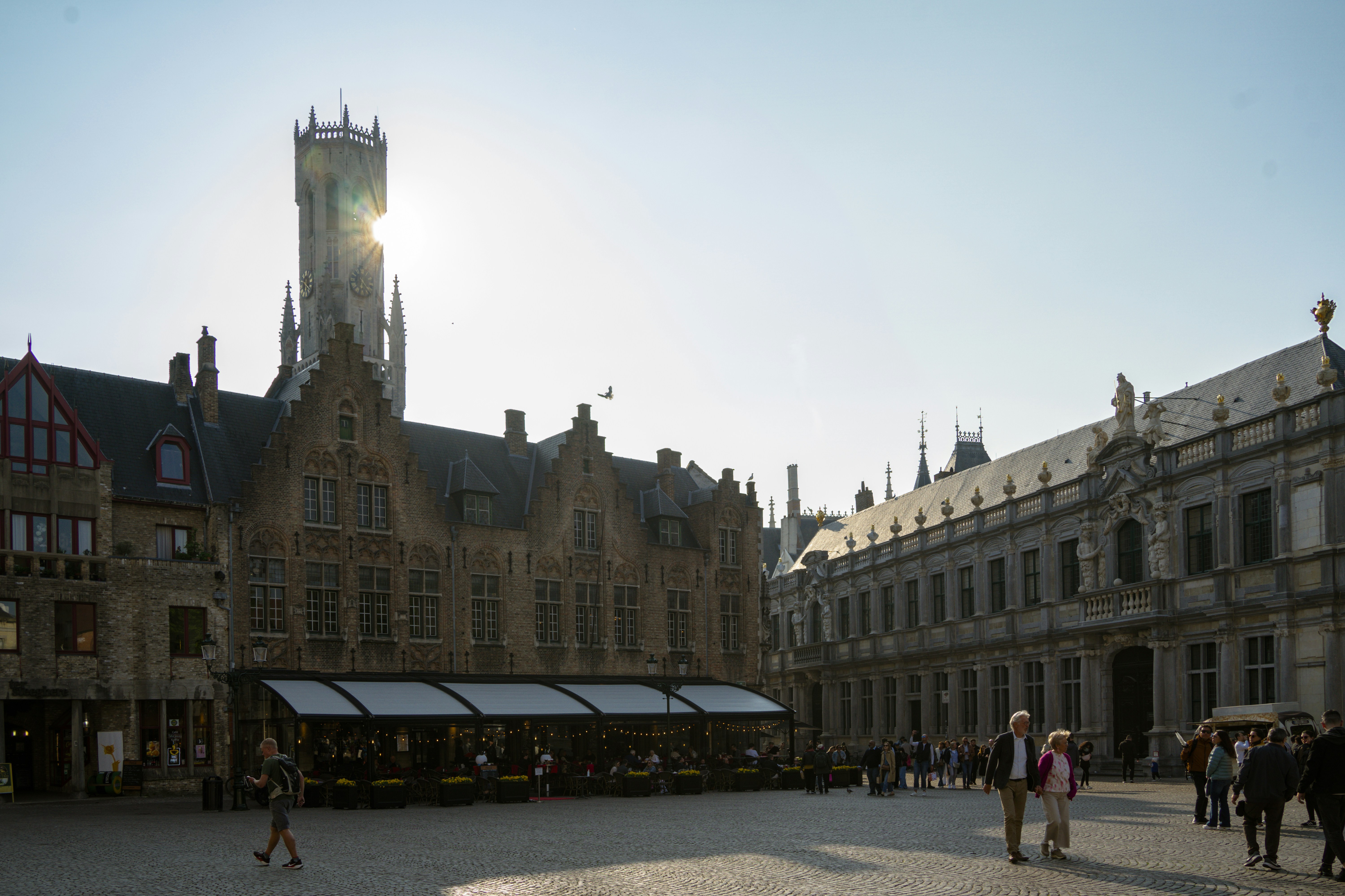 Historic european square with bell tower and buildings.