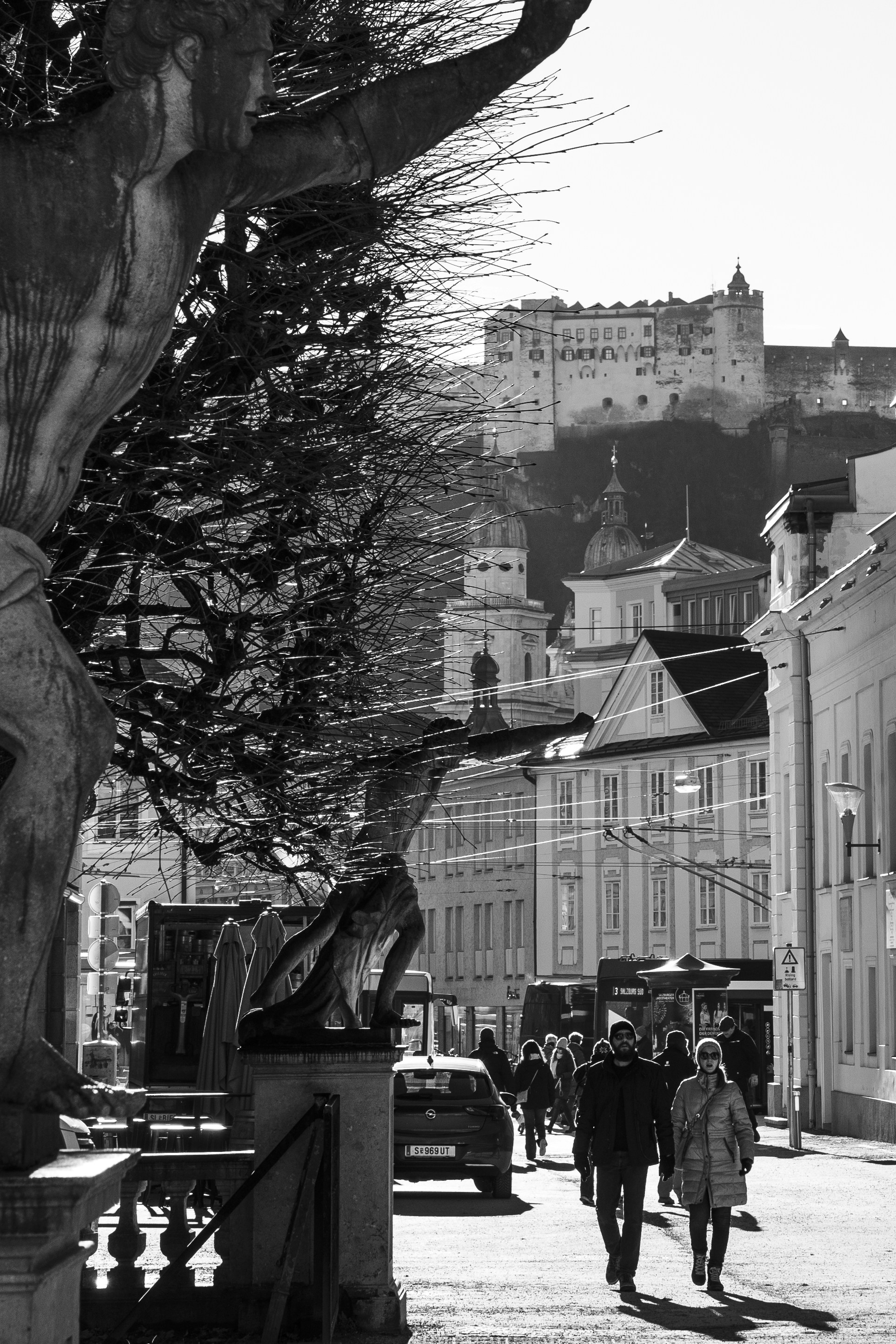 Greystone Corridor: Pedestrians Beneath a Fortress Skyline
