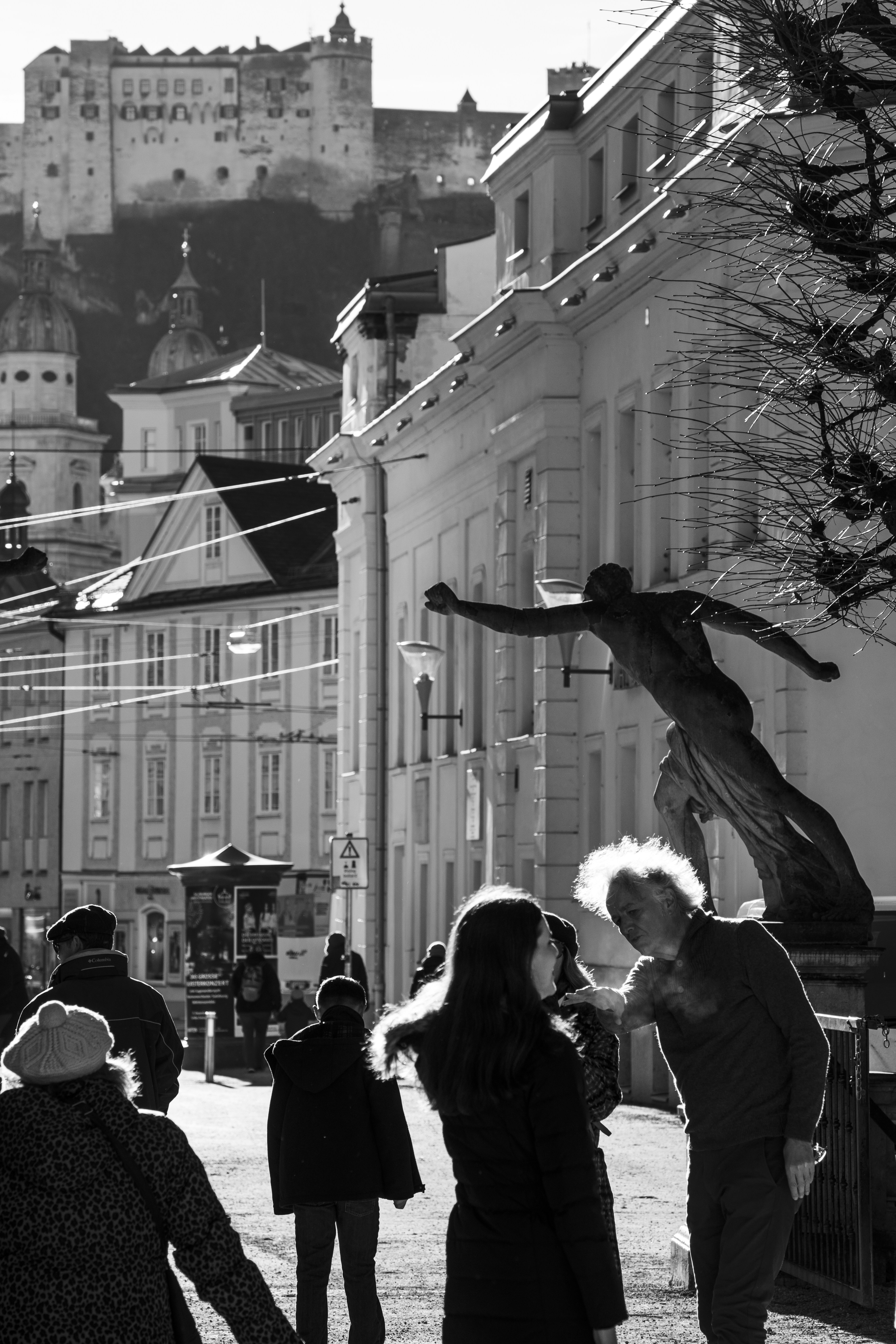 Leaning Statue by Castle Street: A Black-and-White Street Moment