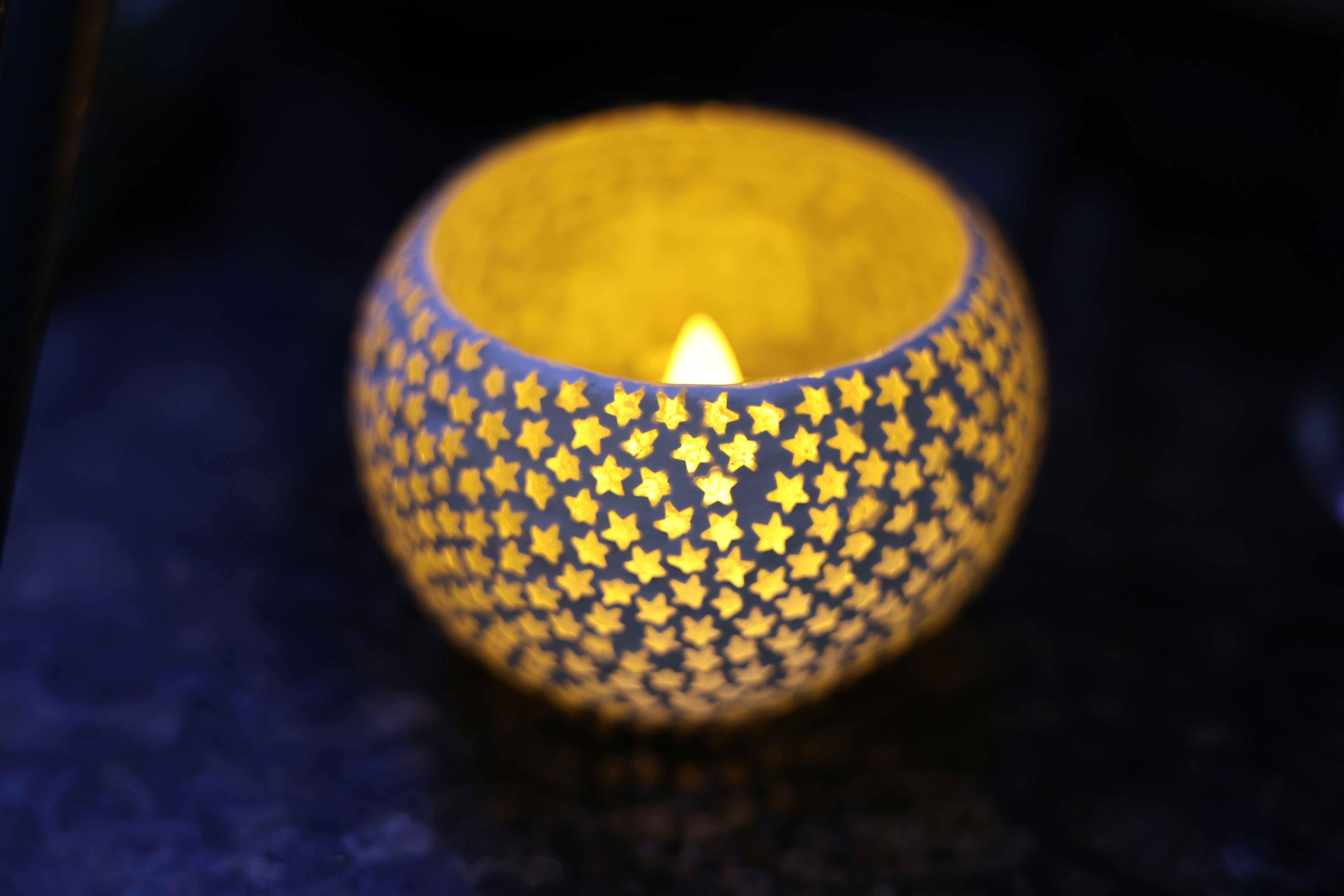Star-Cut Lantern Ember: Candlelight Peeking Through a Globe of Stars