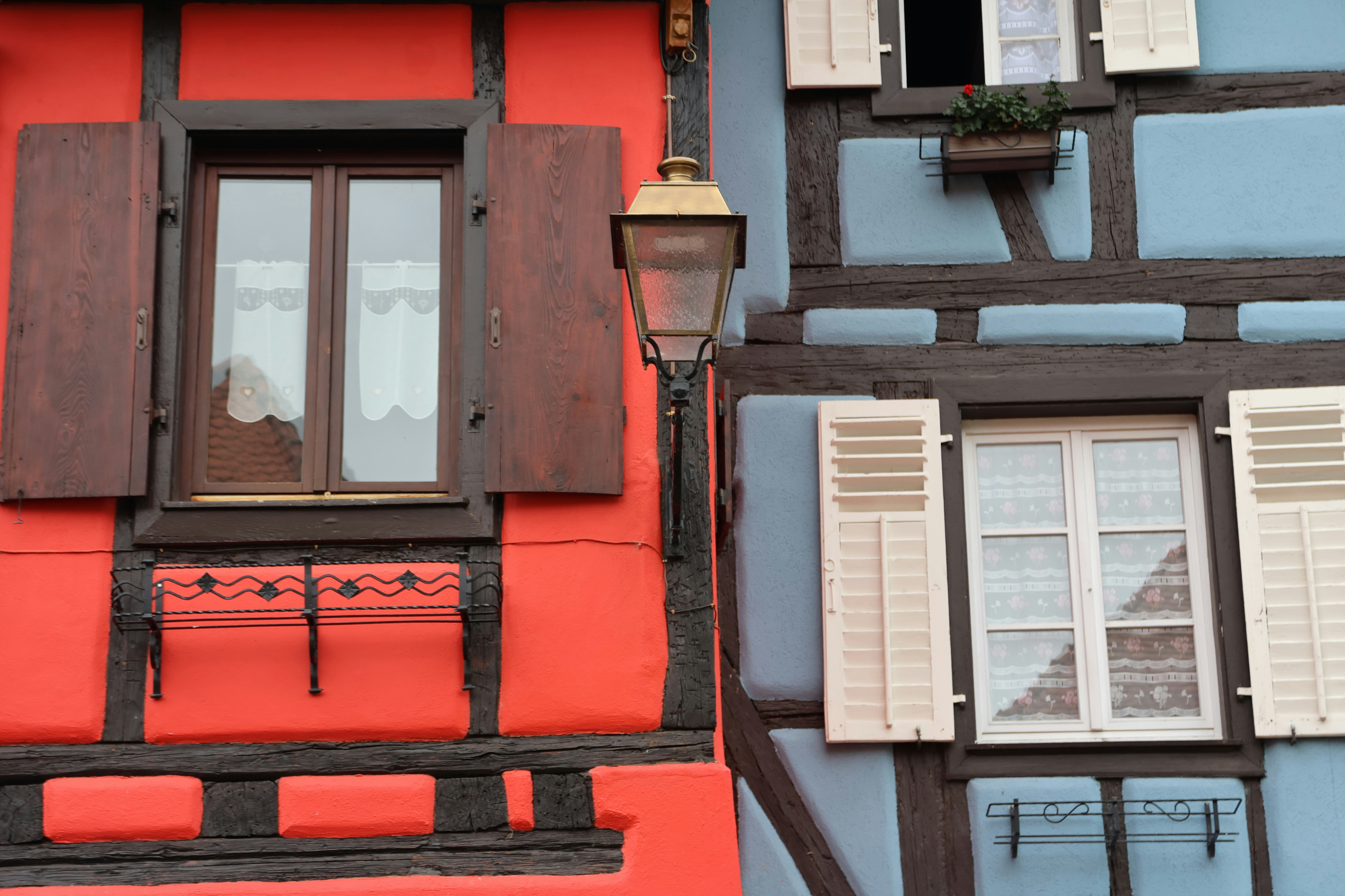 Half-timbered buildings with red and blue walls