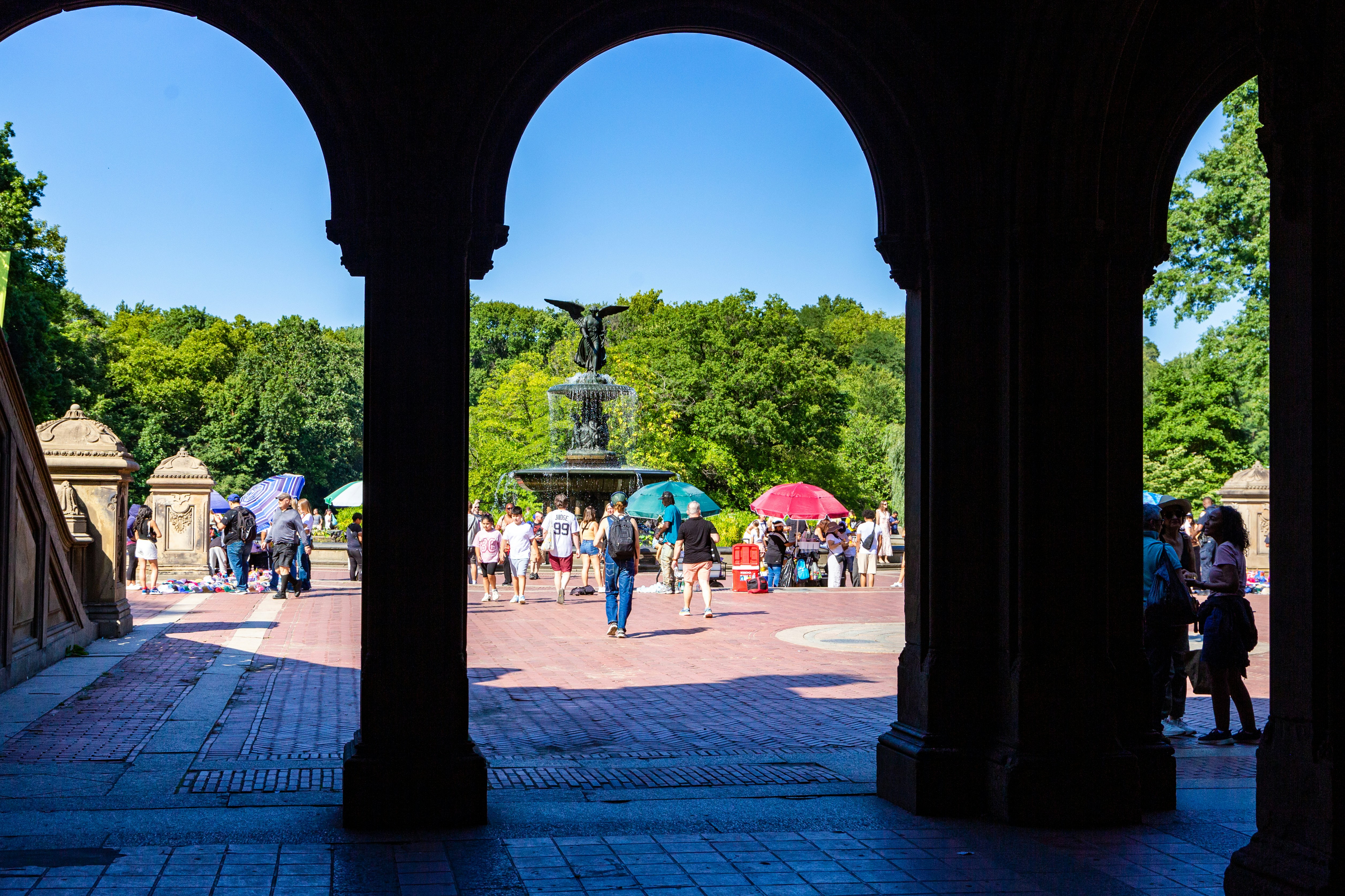A Glimpse Through Arches: Central Park's Vibrant Heart