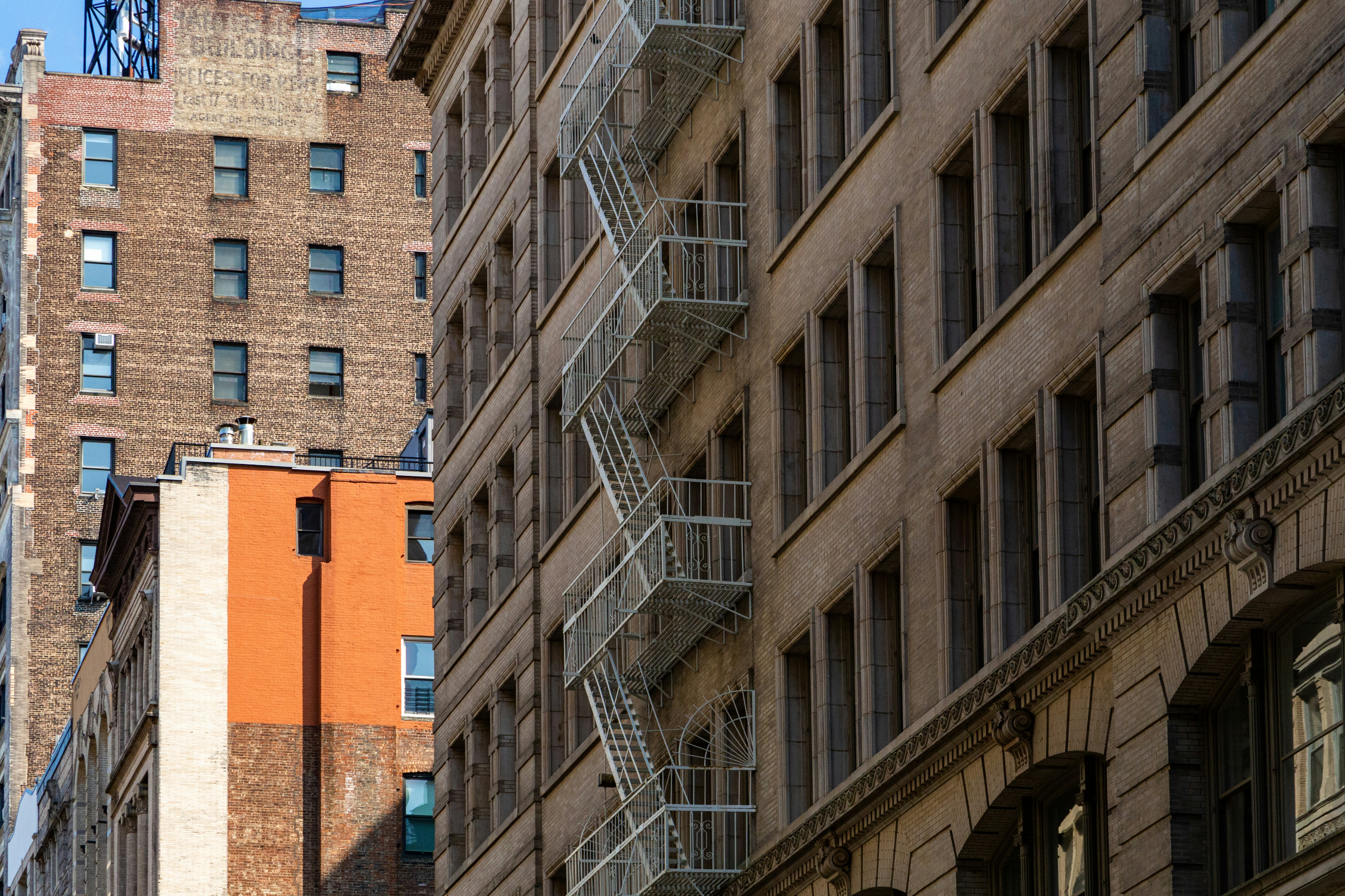 Buildings with fire escape stairs on side