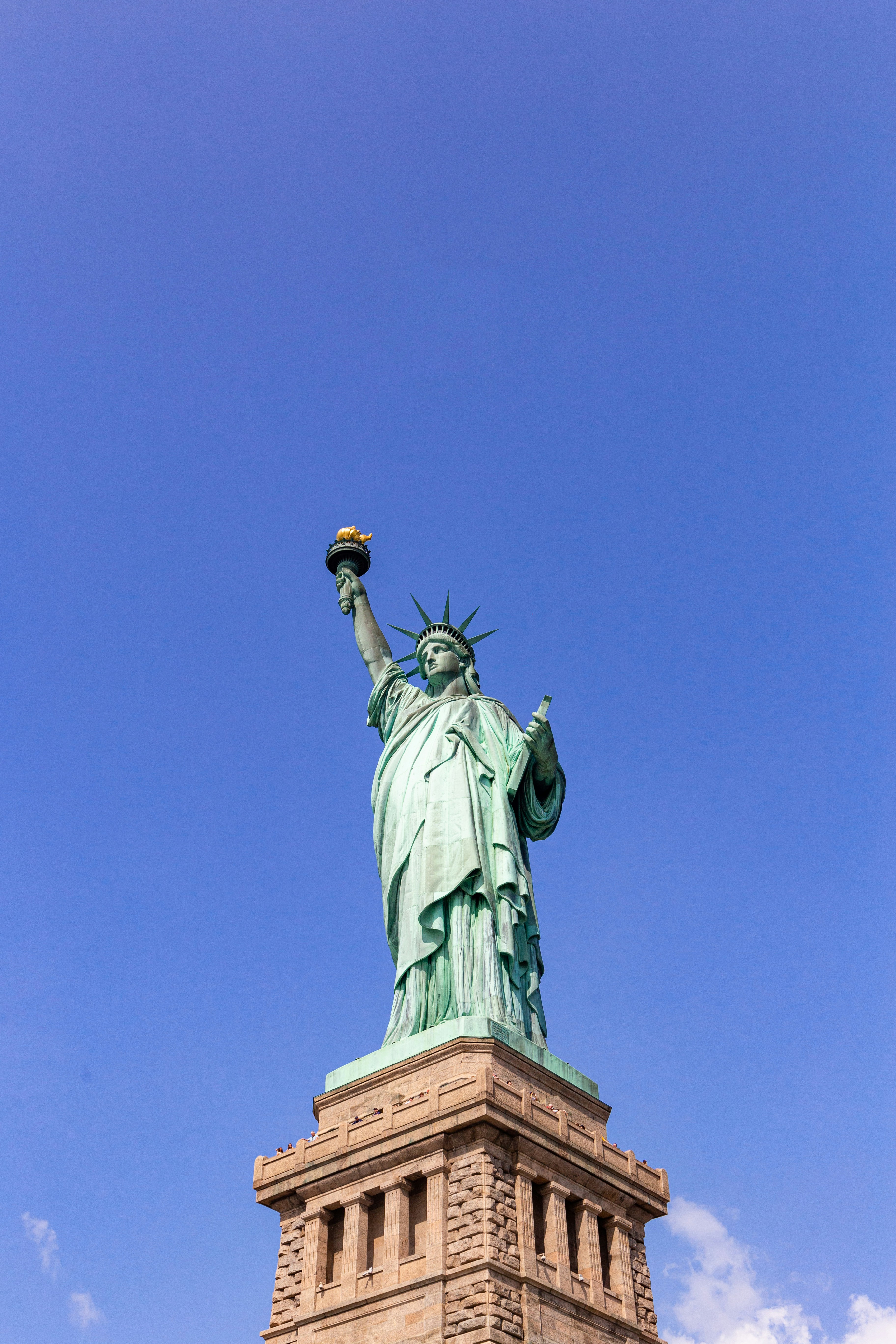 Torchbearer in a Cerulean Sky: Liberty Standing Tall