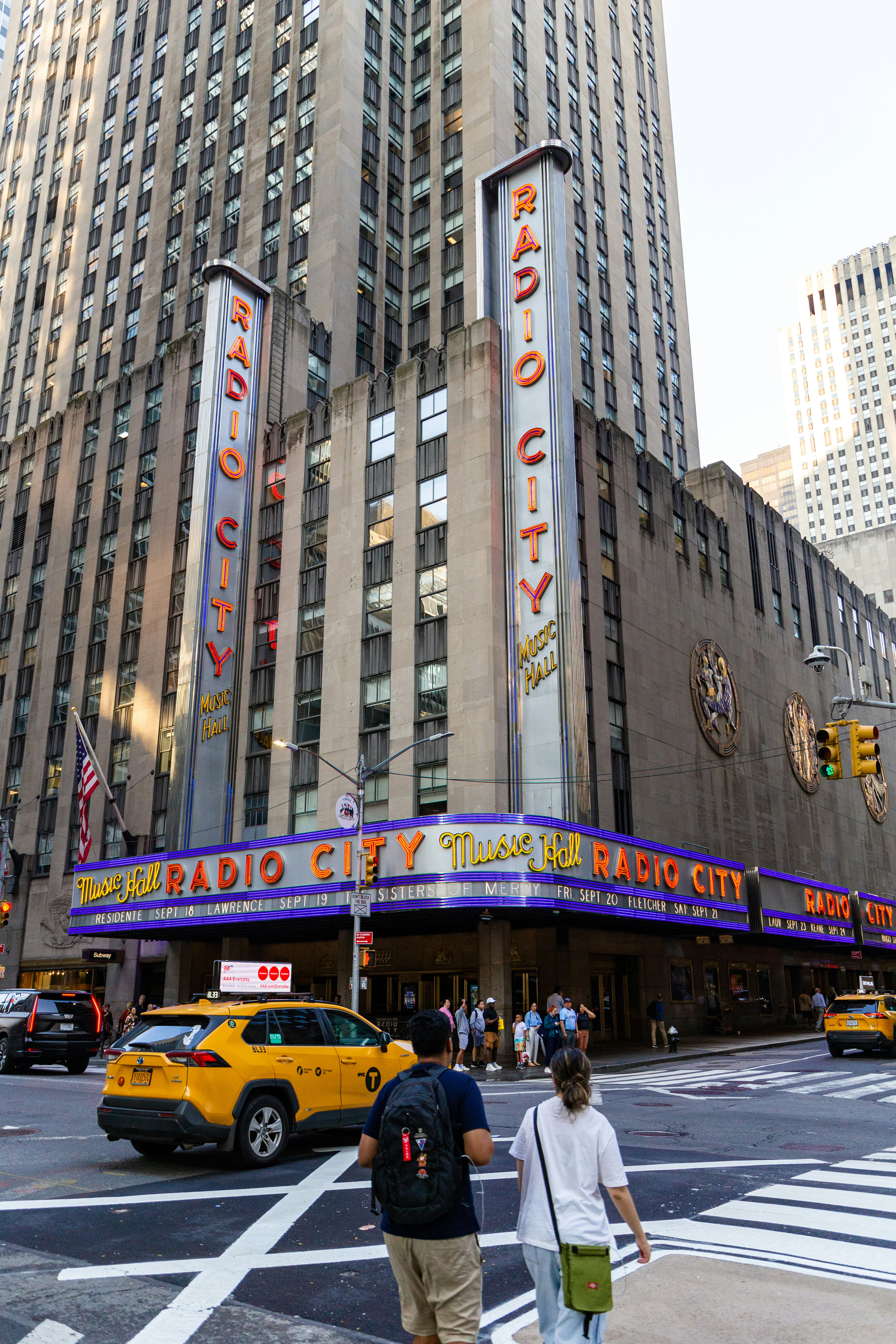 Vertical Neon Icon: Radio City’s Facade Framed by Midtown Street Pulse