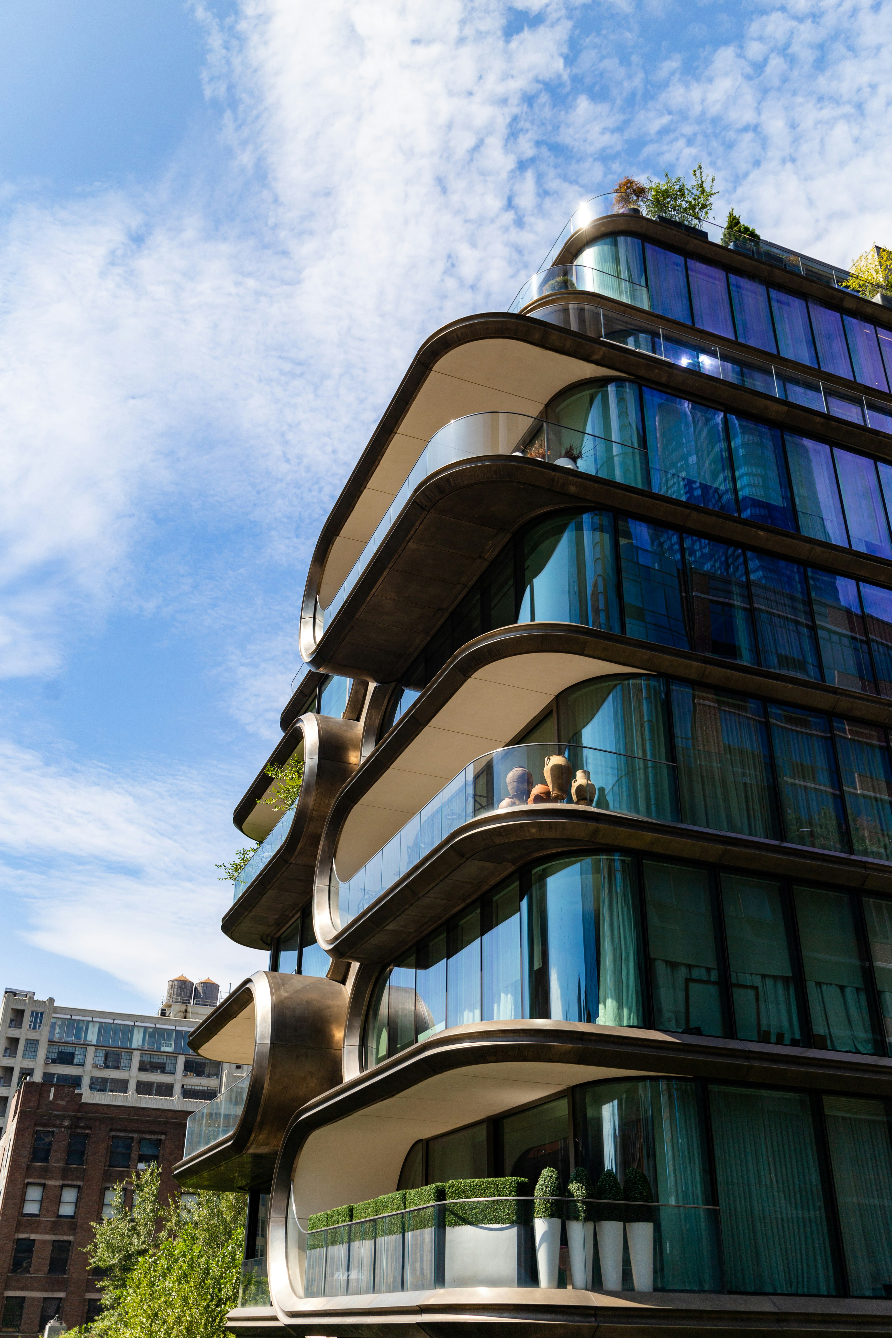 Curved Glass Ribbons Rise: A Skyward Portrait of Modern Balconies