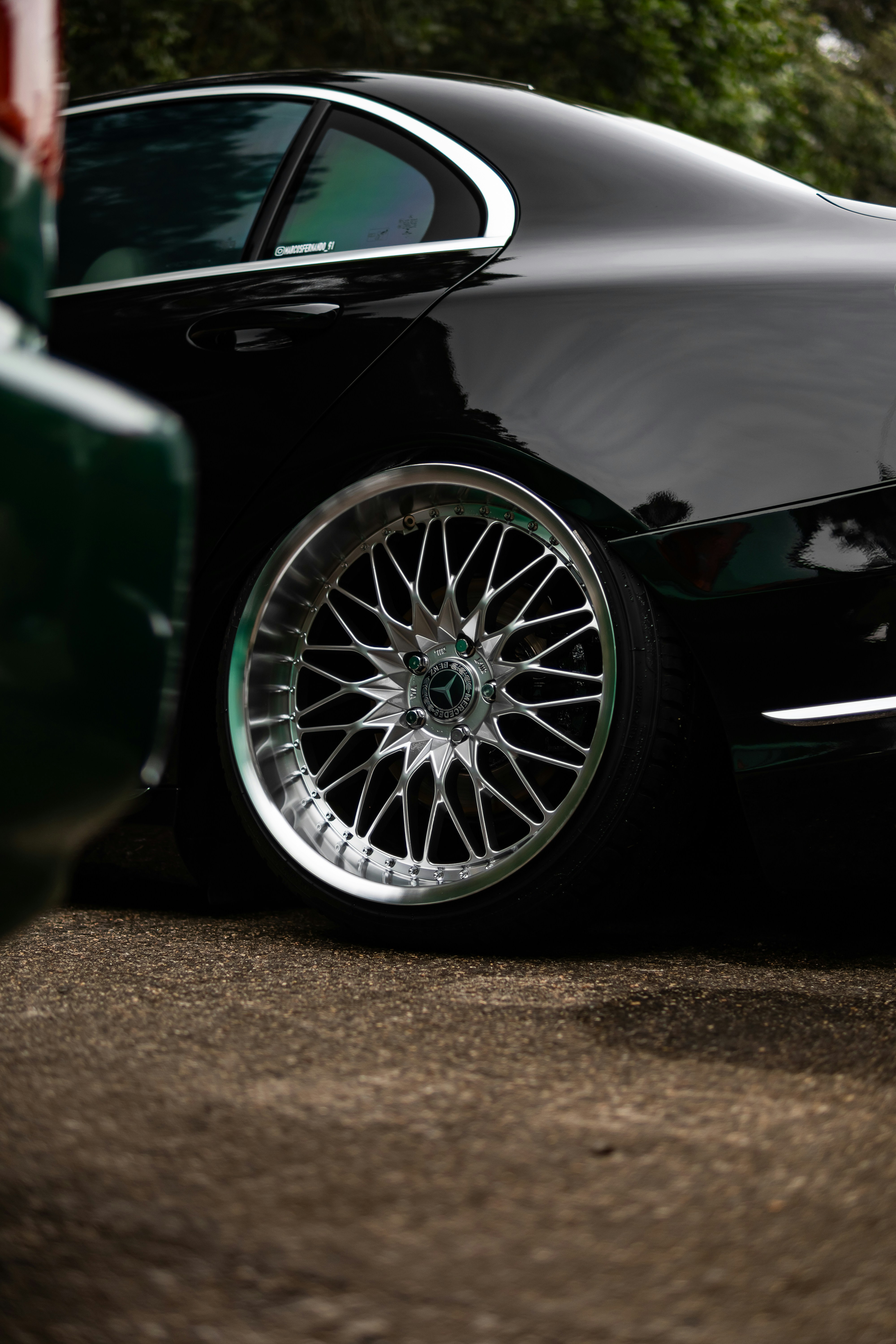 Chrome and Shadow: A Low-Angle Glimpse of a Dreamy Wheel