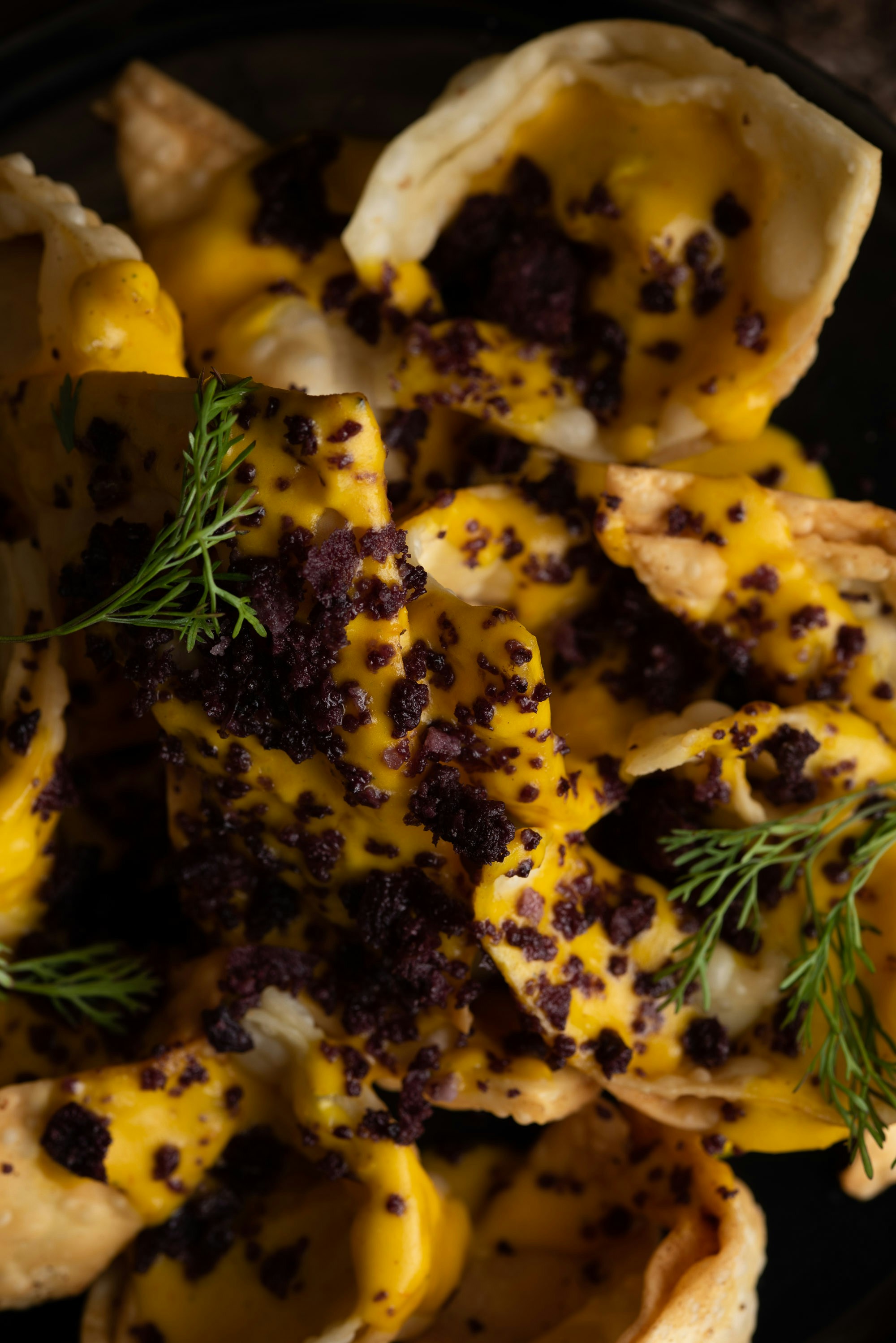 Cheddar Crown on Crispy Nachos: A Close-Up of Melt and Crunch