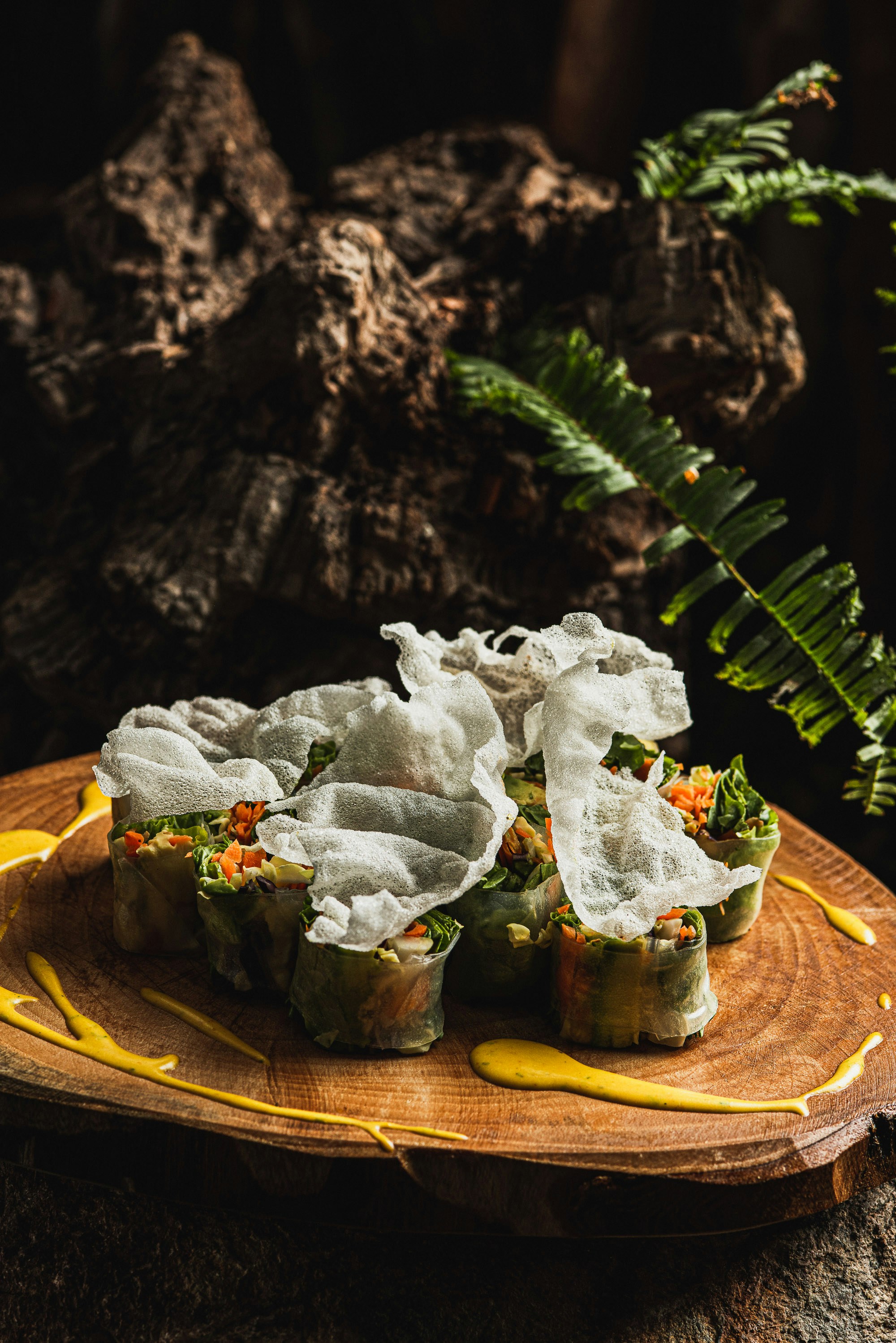 Crisp-Topped Sushi Crowns on a Rustic Wooden Board
