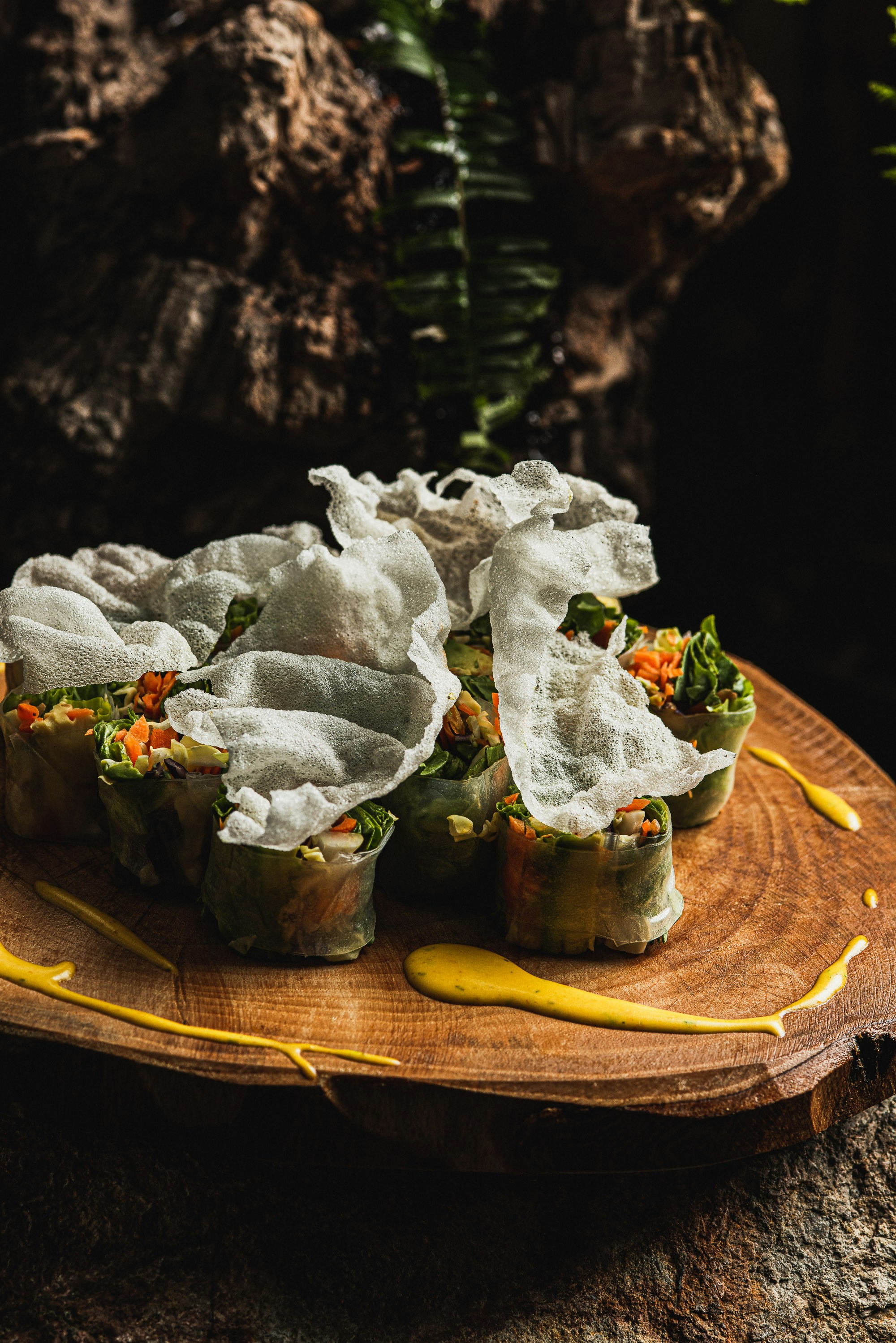 Crisp Crowned Sushi: Tiny Towers on a Rustic Round Board
