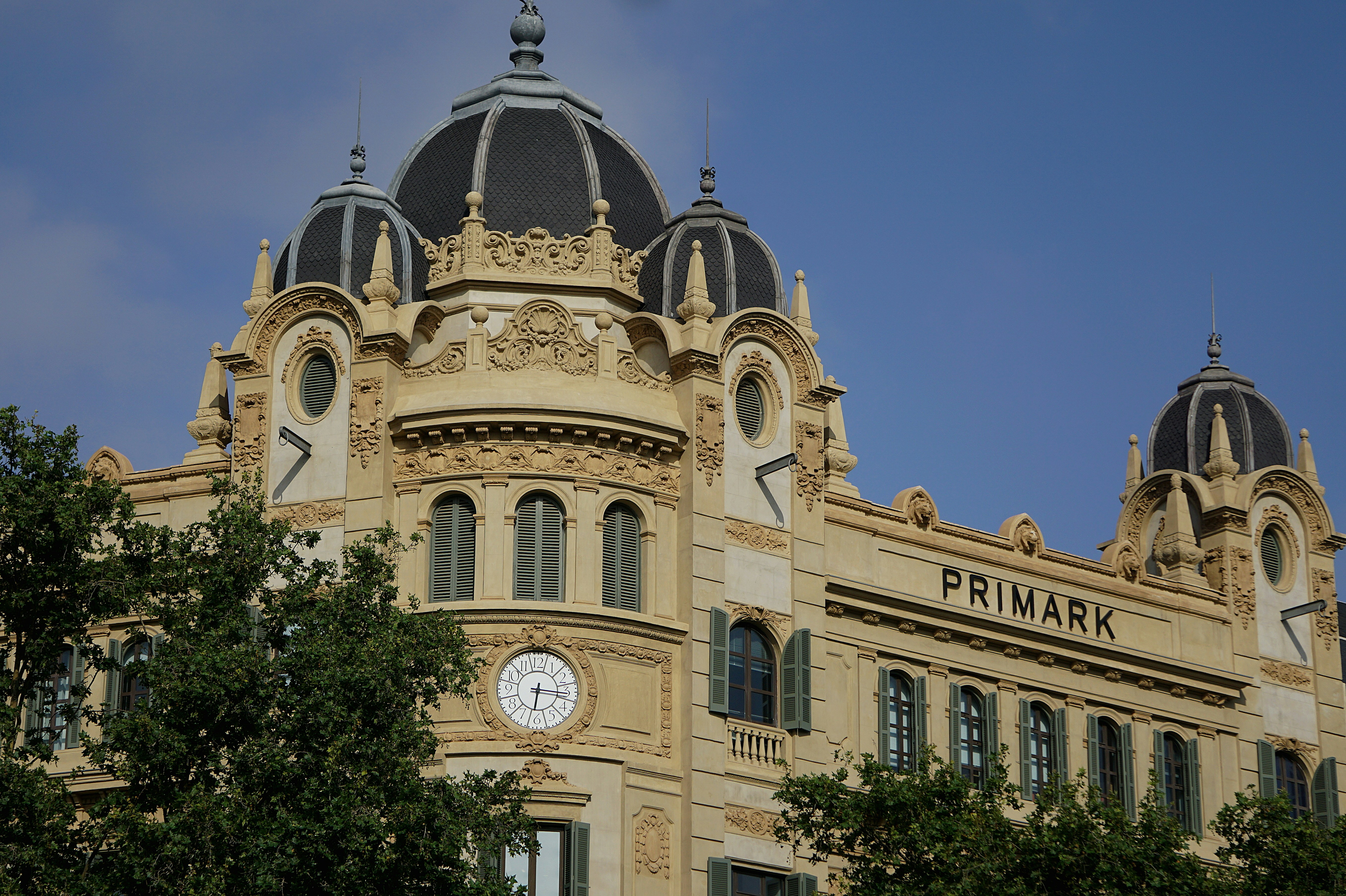 Dome-Crowned Facade: A Primark store framed by ornate sandstone architecture