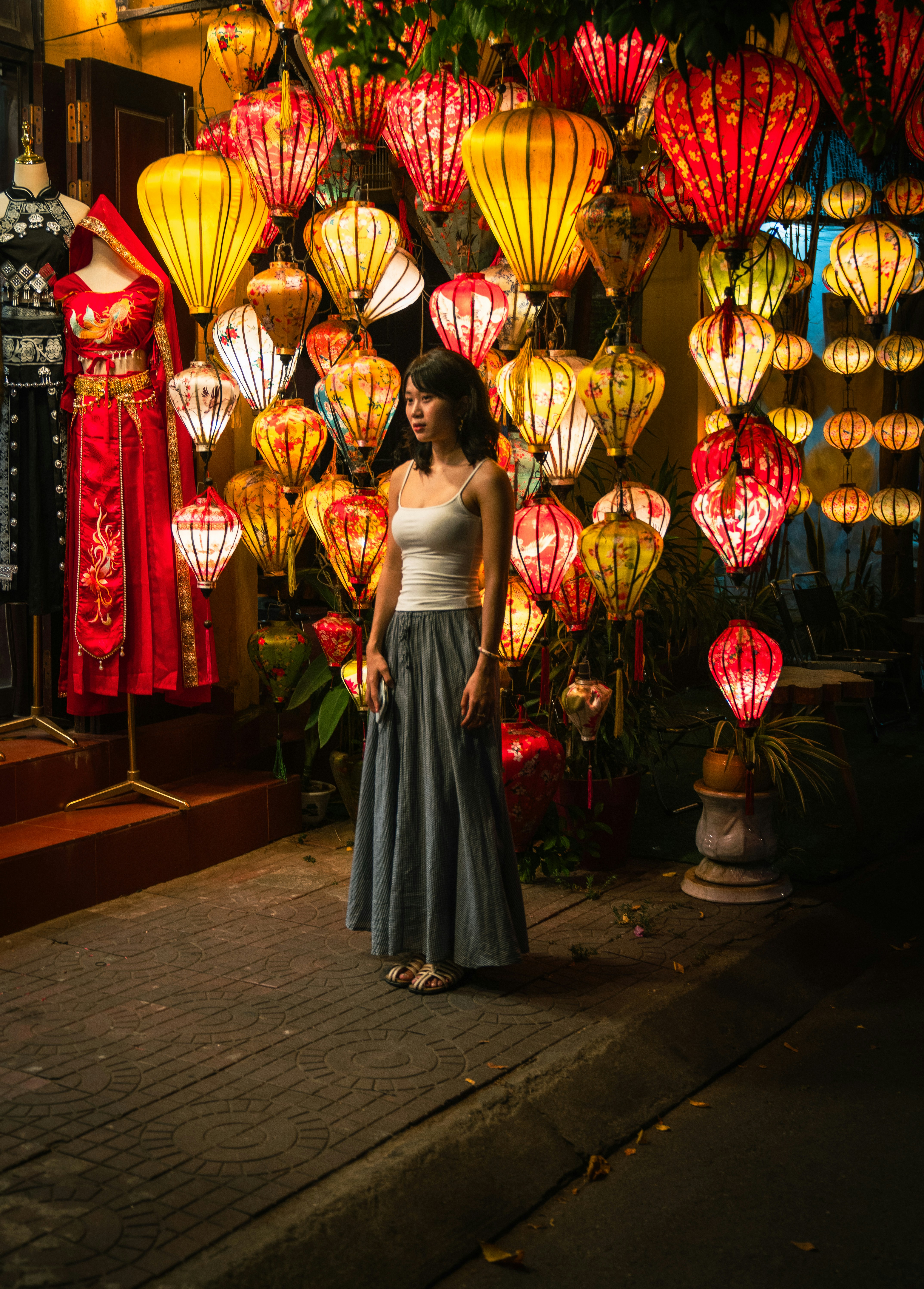 Lantern Choir: A Quiet Portrait Beneath a Night Market of Glowing Orbs