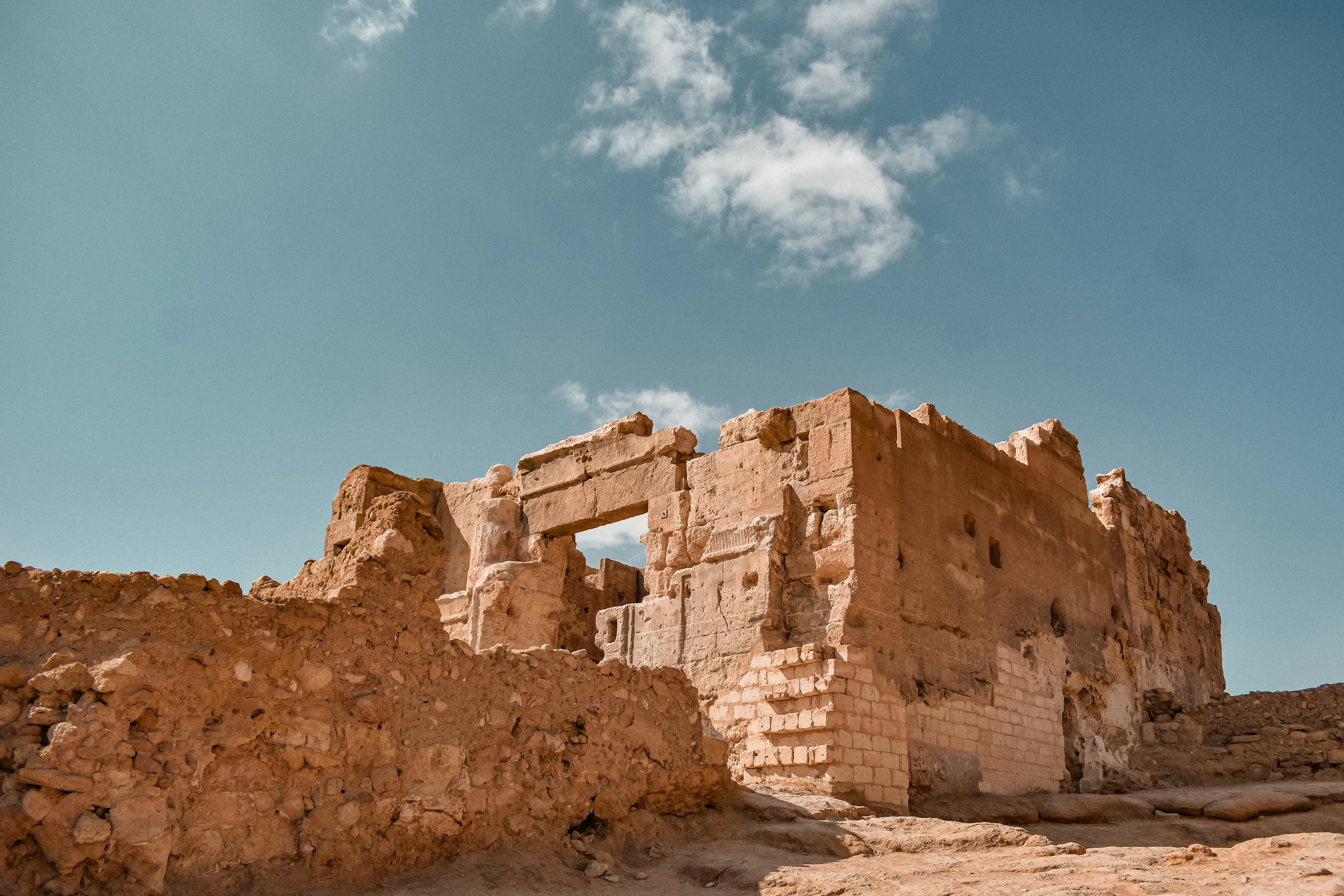 Ancient ruins under a bright blue sky