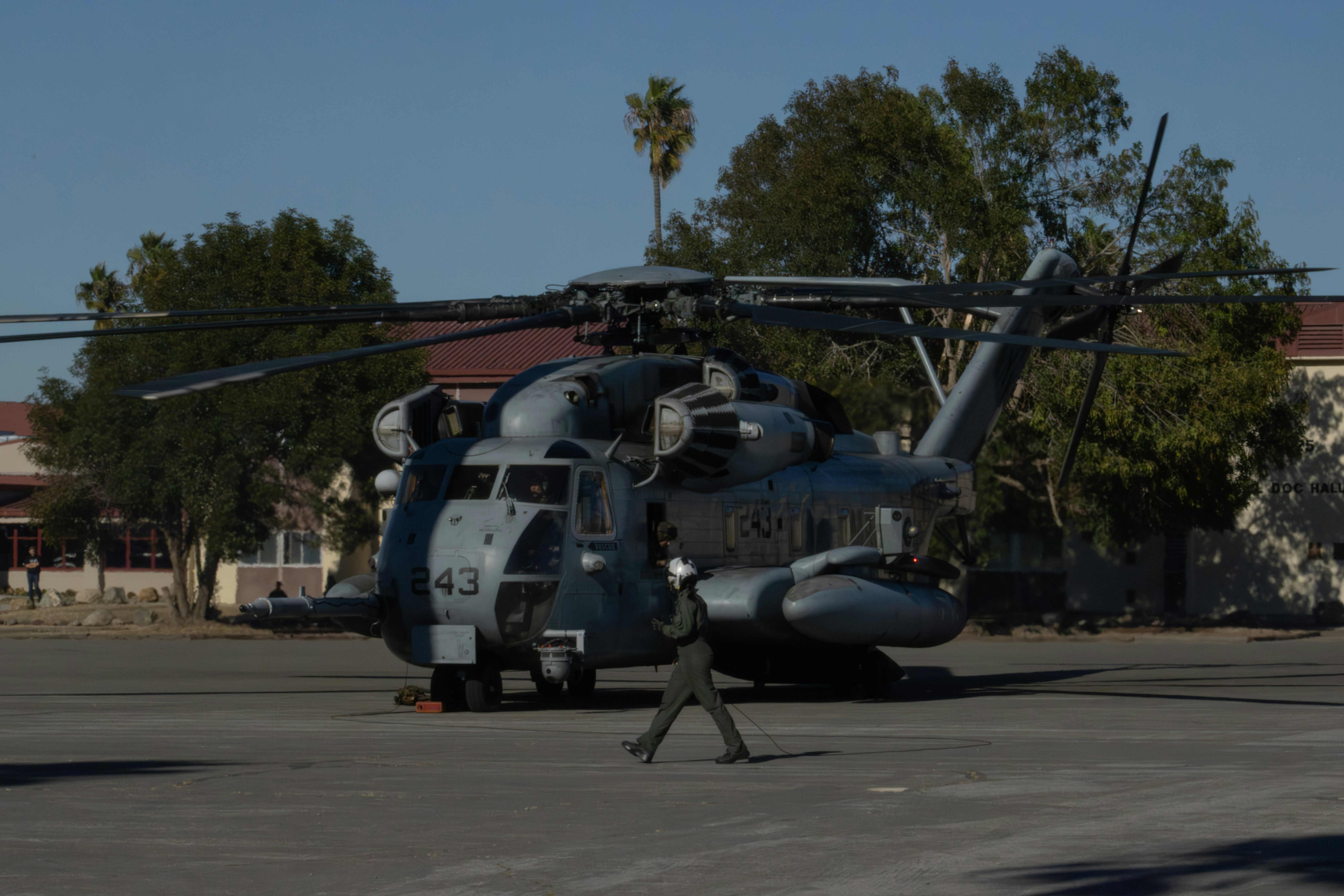Chinook Stillness: A Lone Pedestrian Crossing the Tarmac