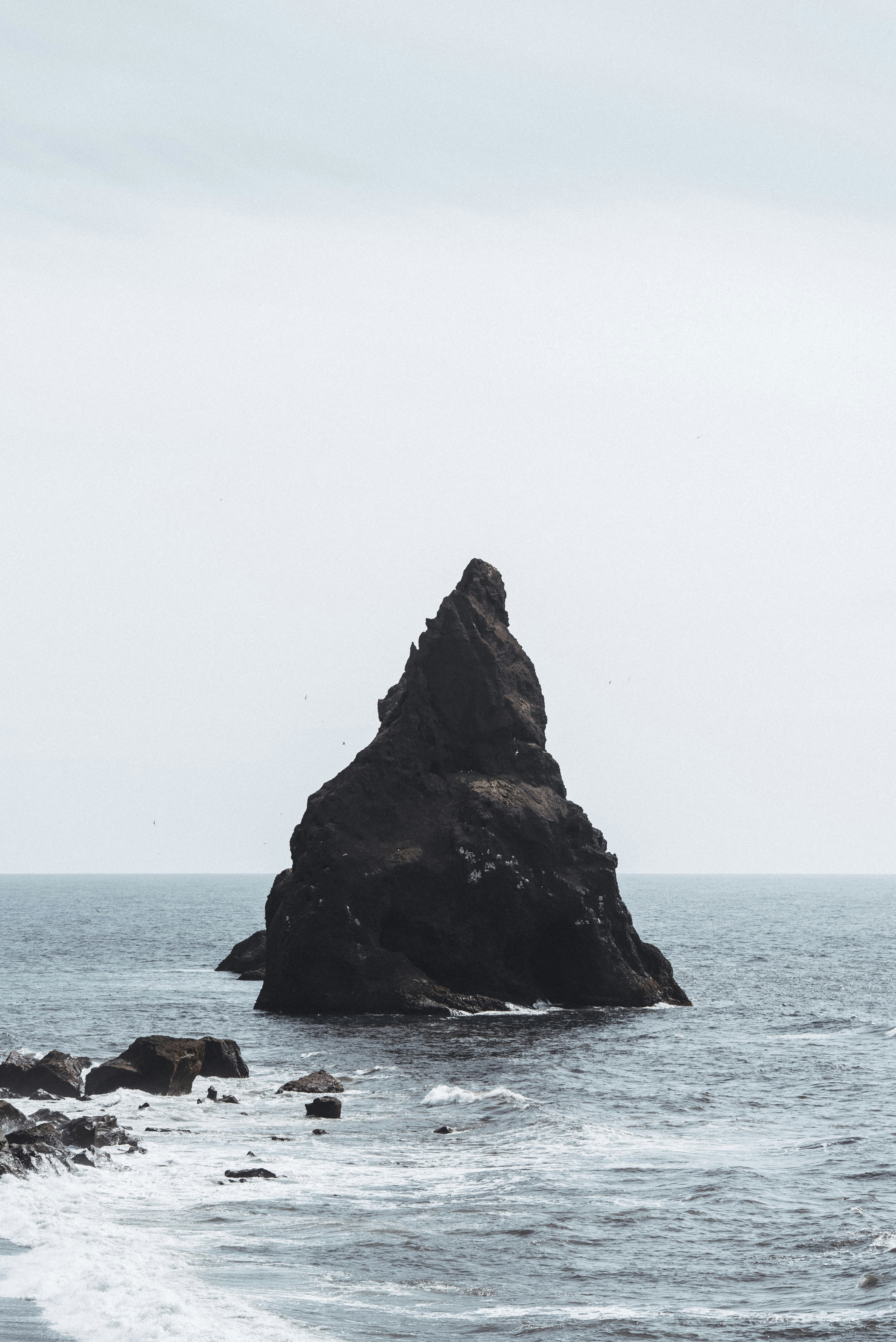 Jagged rock formation in the ocean waves photo – Free Waves Image on ...