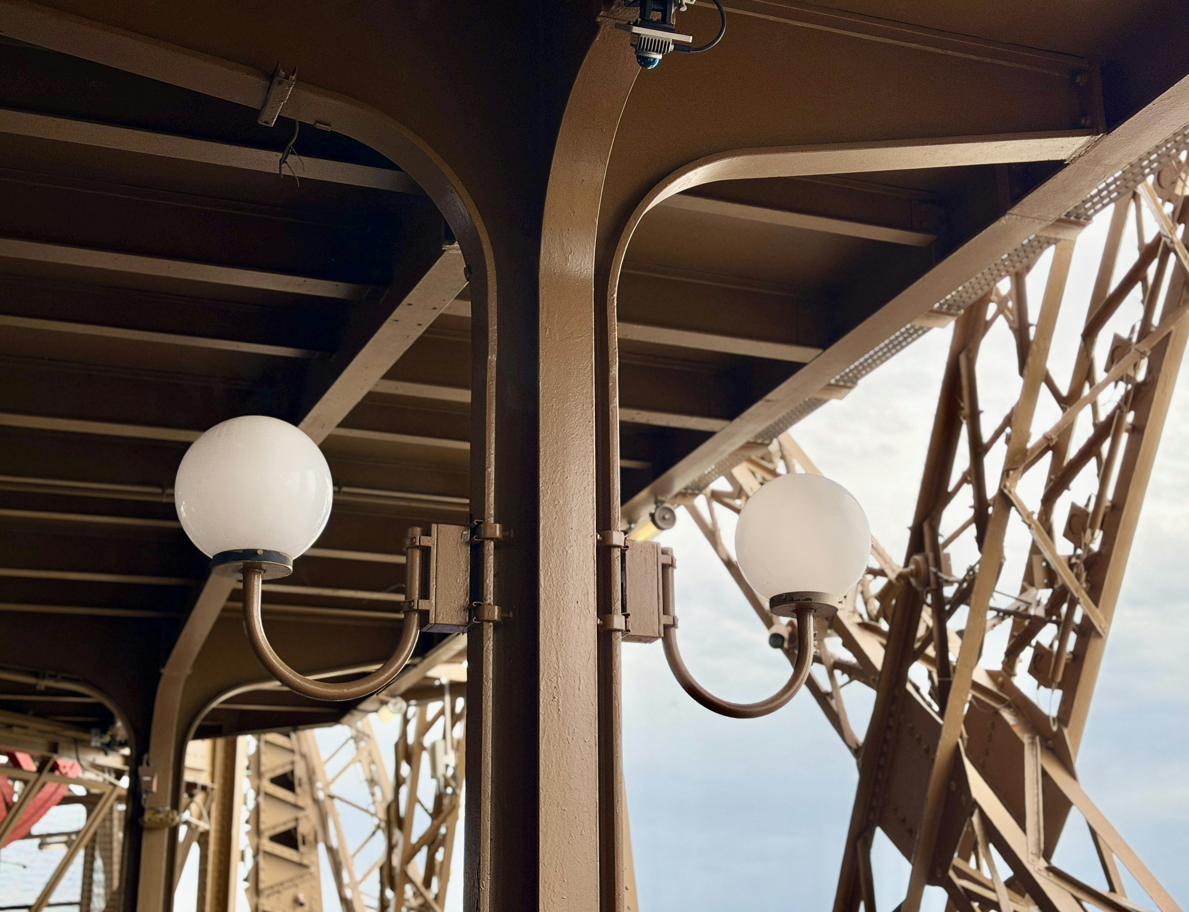Lattice of Light: Spherical Lamps Framing a Steel Bridge