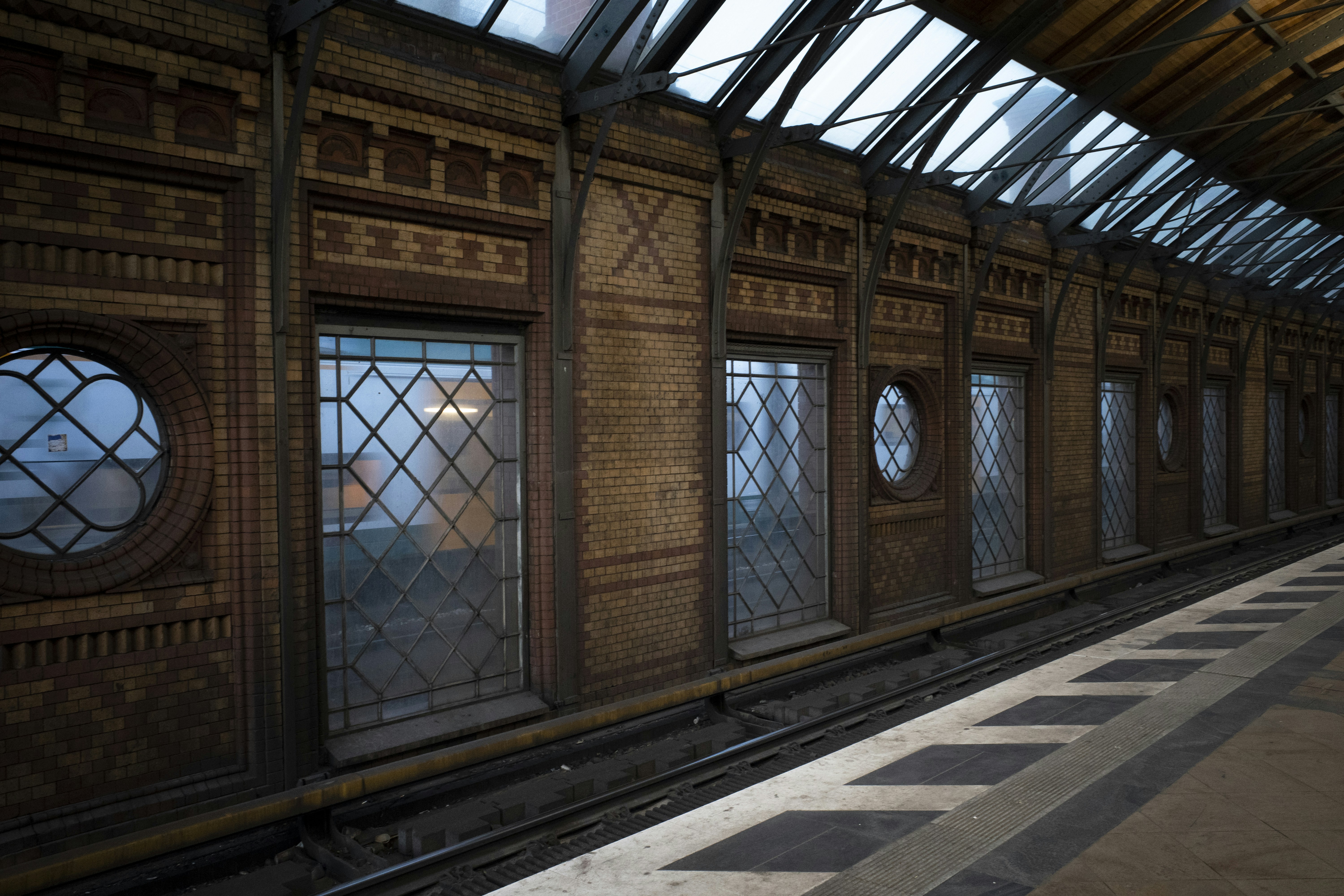 Ornate train station platform with patterned windows