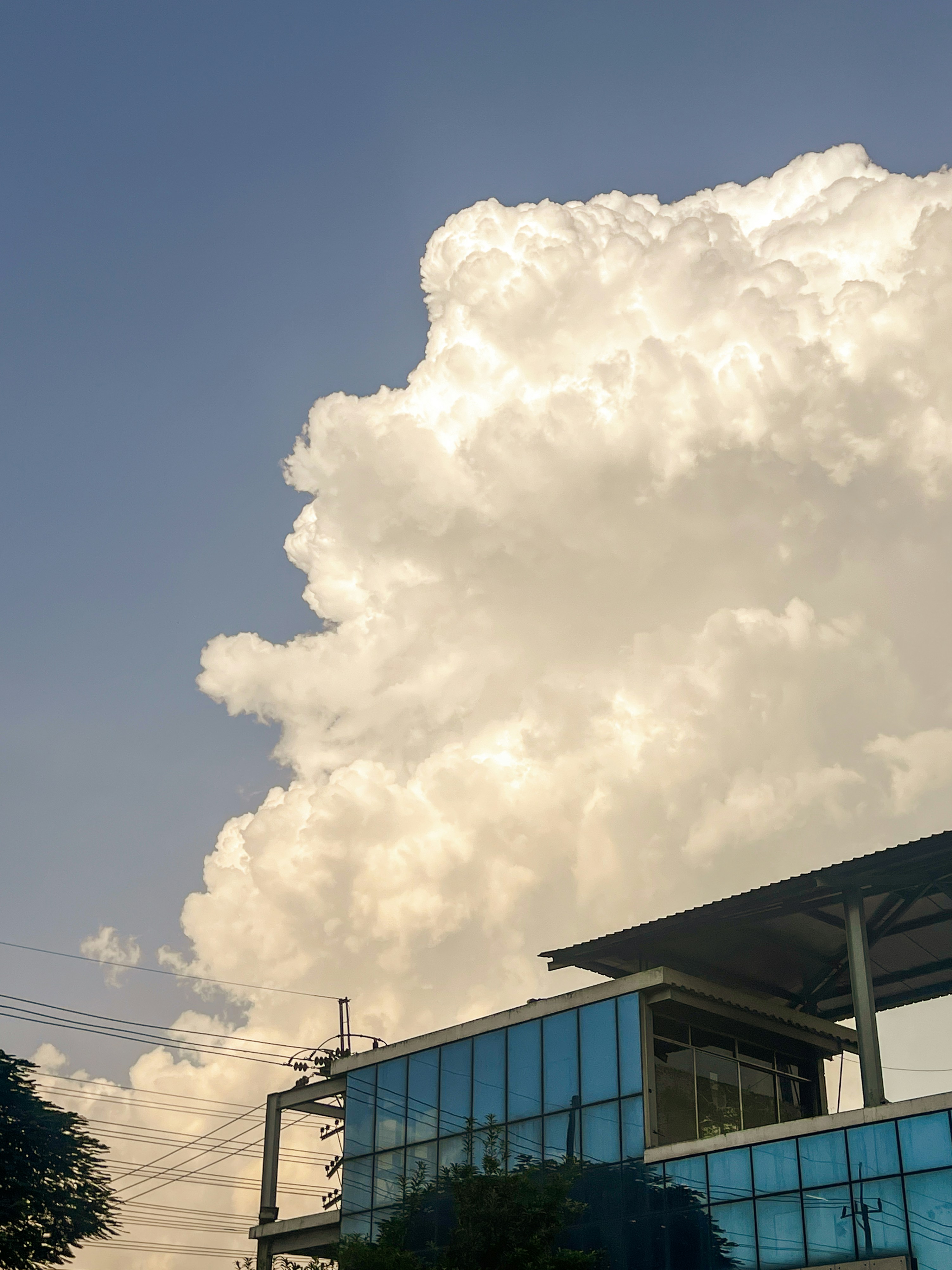 Large cumulus cloud over modern building photo – Free Building Image on ...