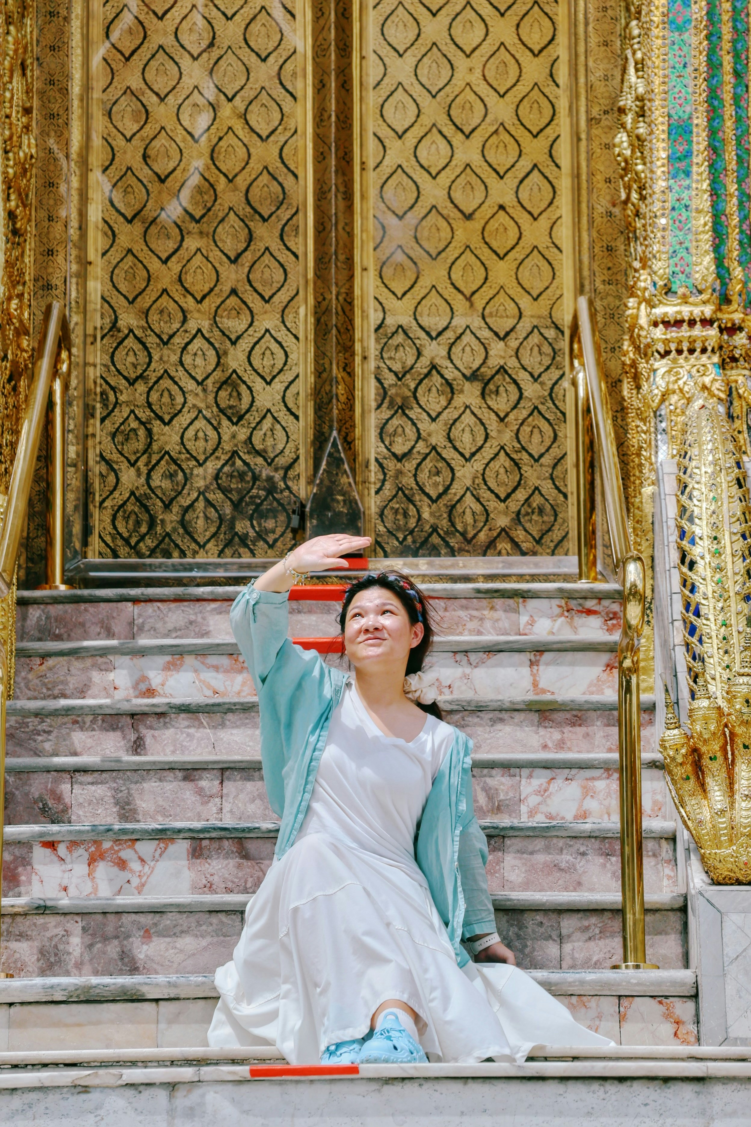 Gilded Threshold: Quiet Portrait on Marble Steps