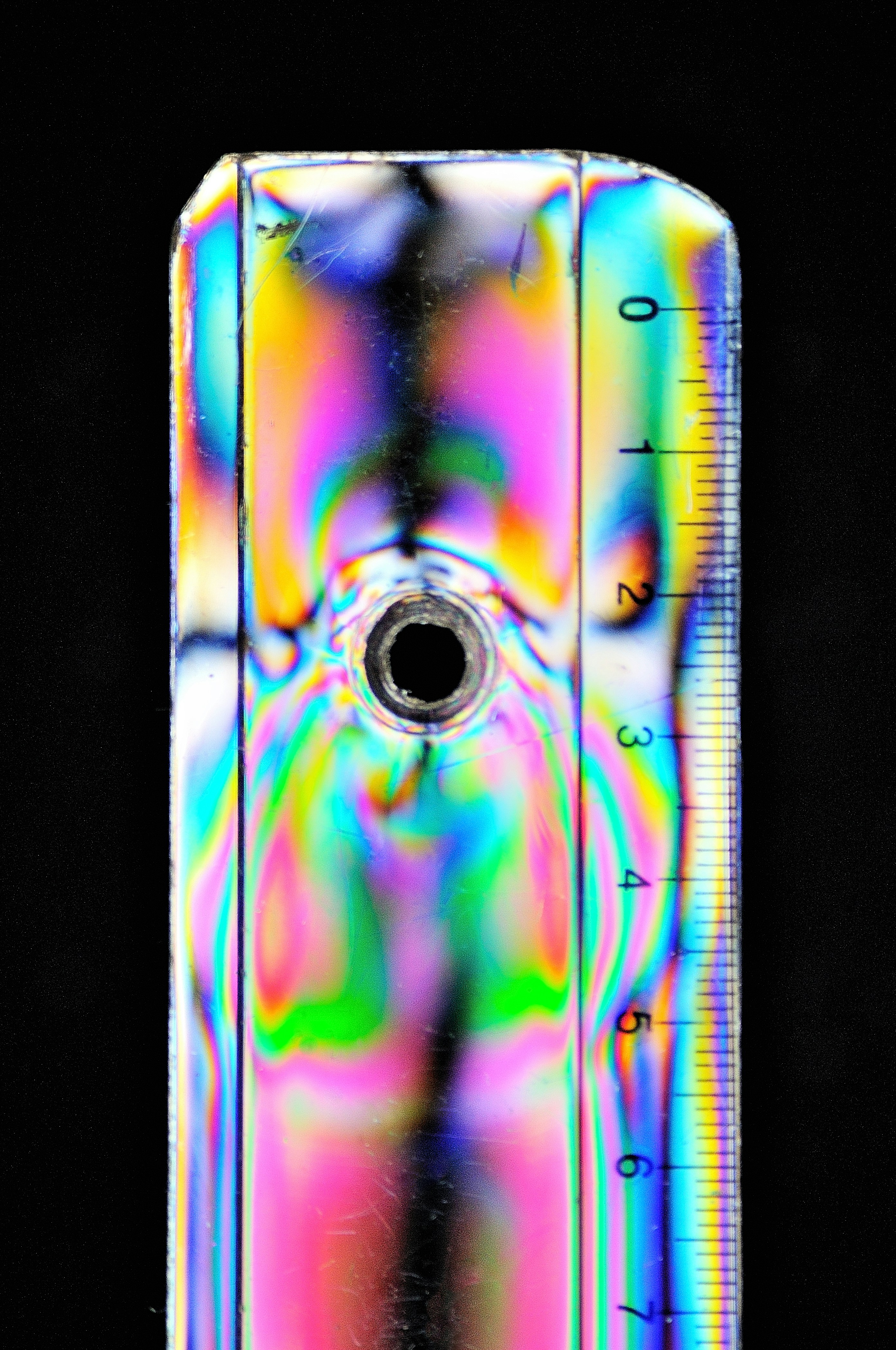 Ruler with colorful stress patterns and strain patterns
