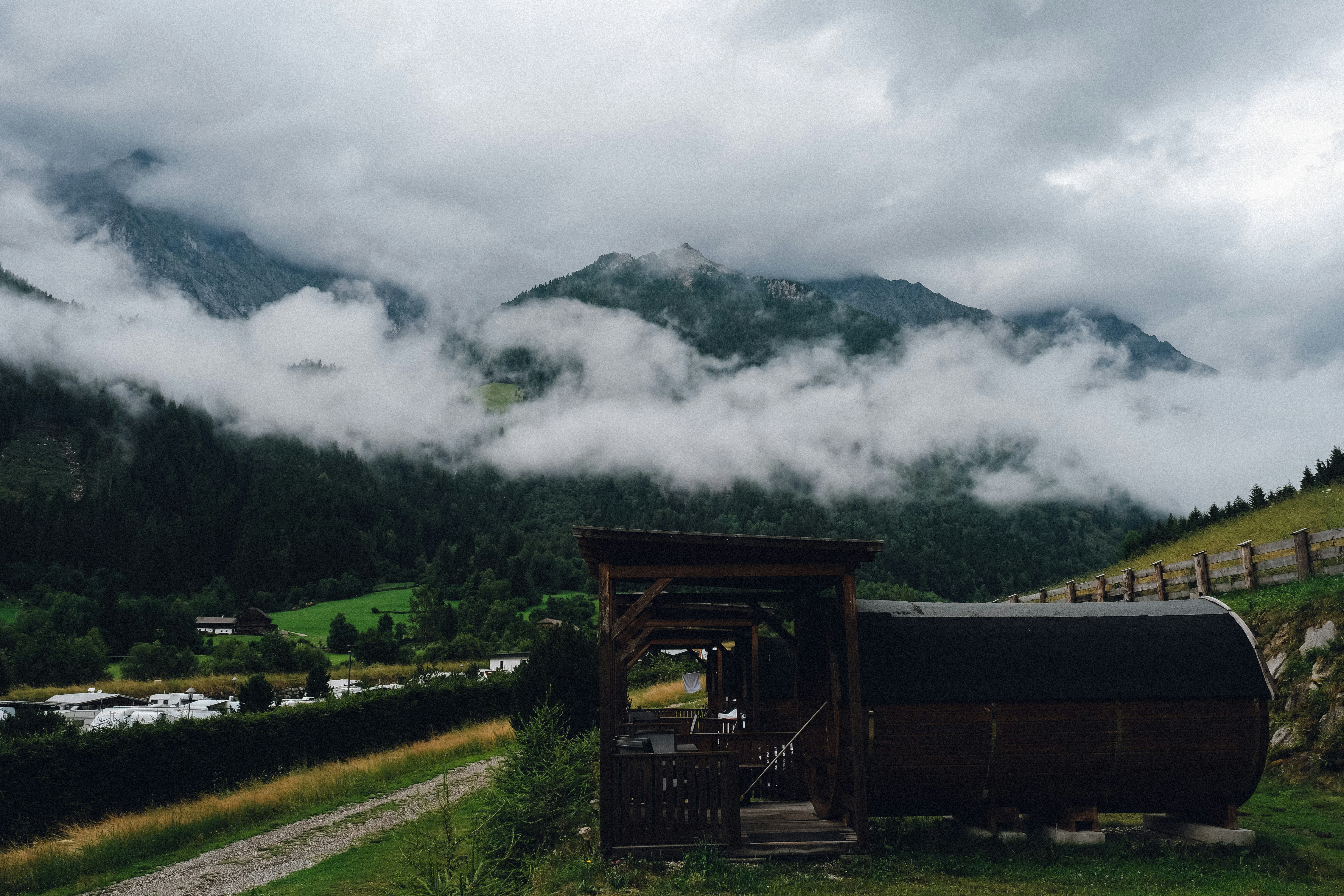 Timber Shelter at the Cloud-Kissed Valley Edge