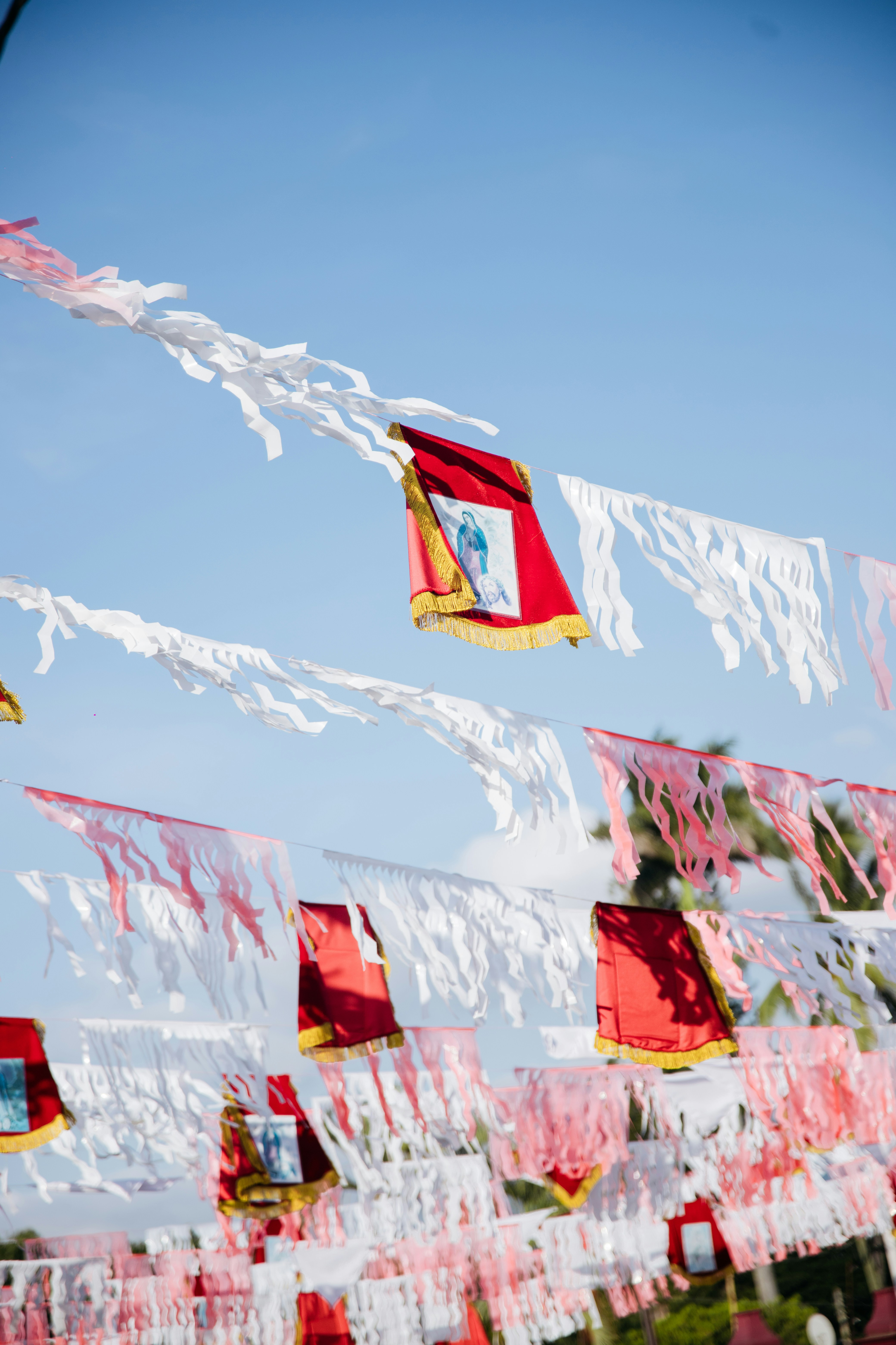 Red-Frame Flag Under a Sky of Prayer Flags