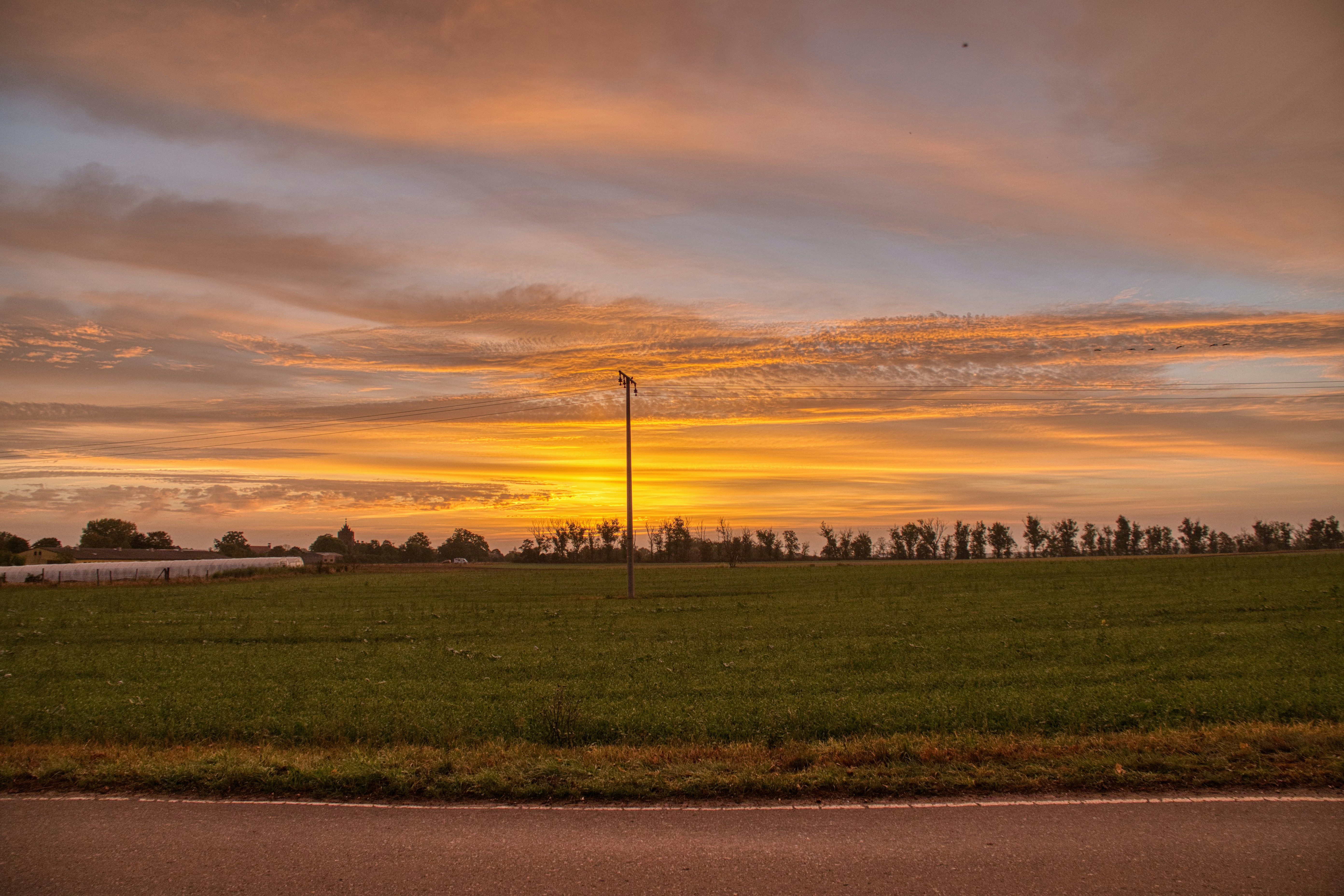Pole at Dusk: A Quiet Prairie Under a Warm Horizon