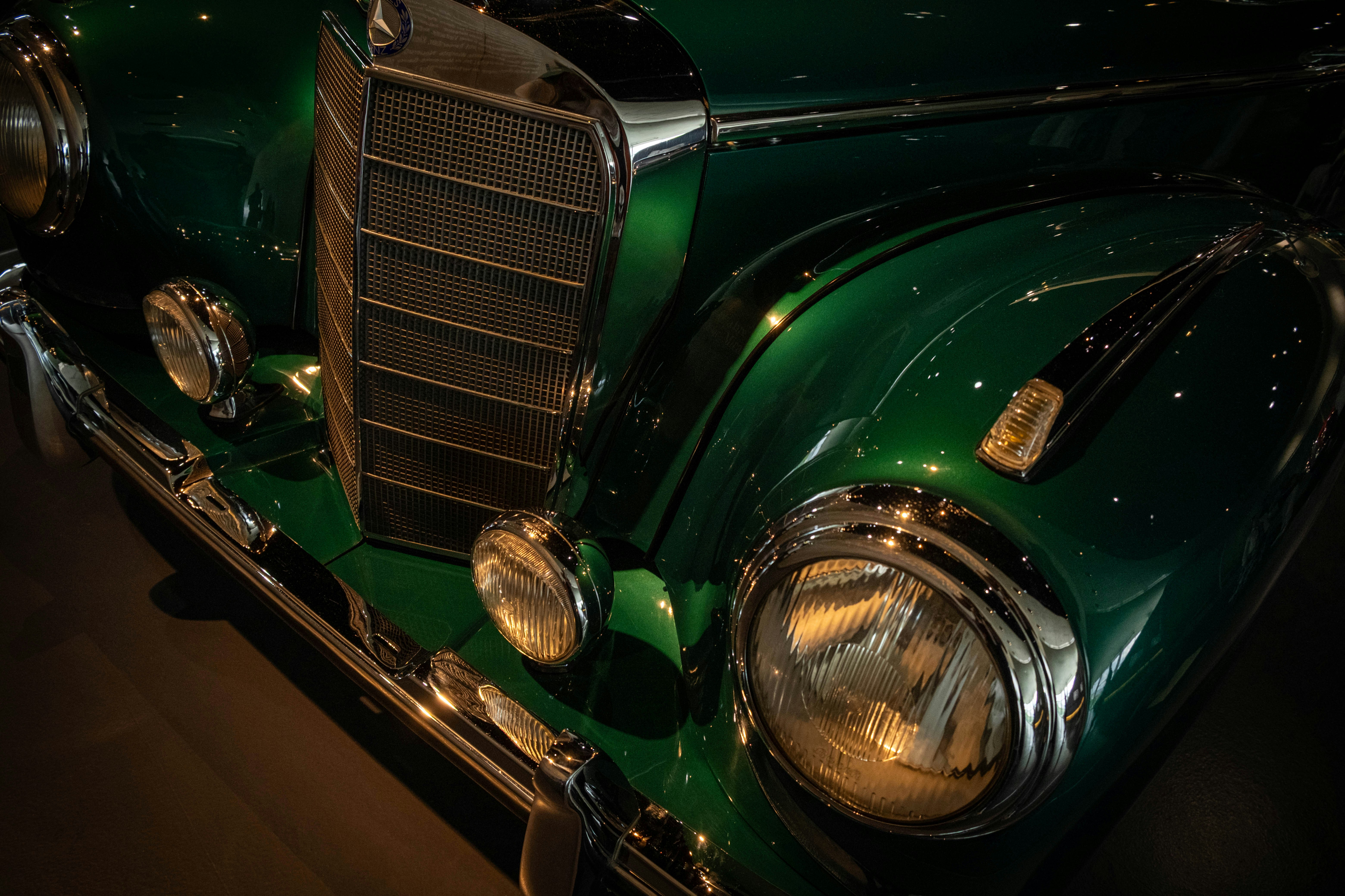 Emerald Chrome Gateway: front-quarter of a vintage car with gleaming grille