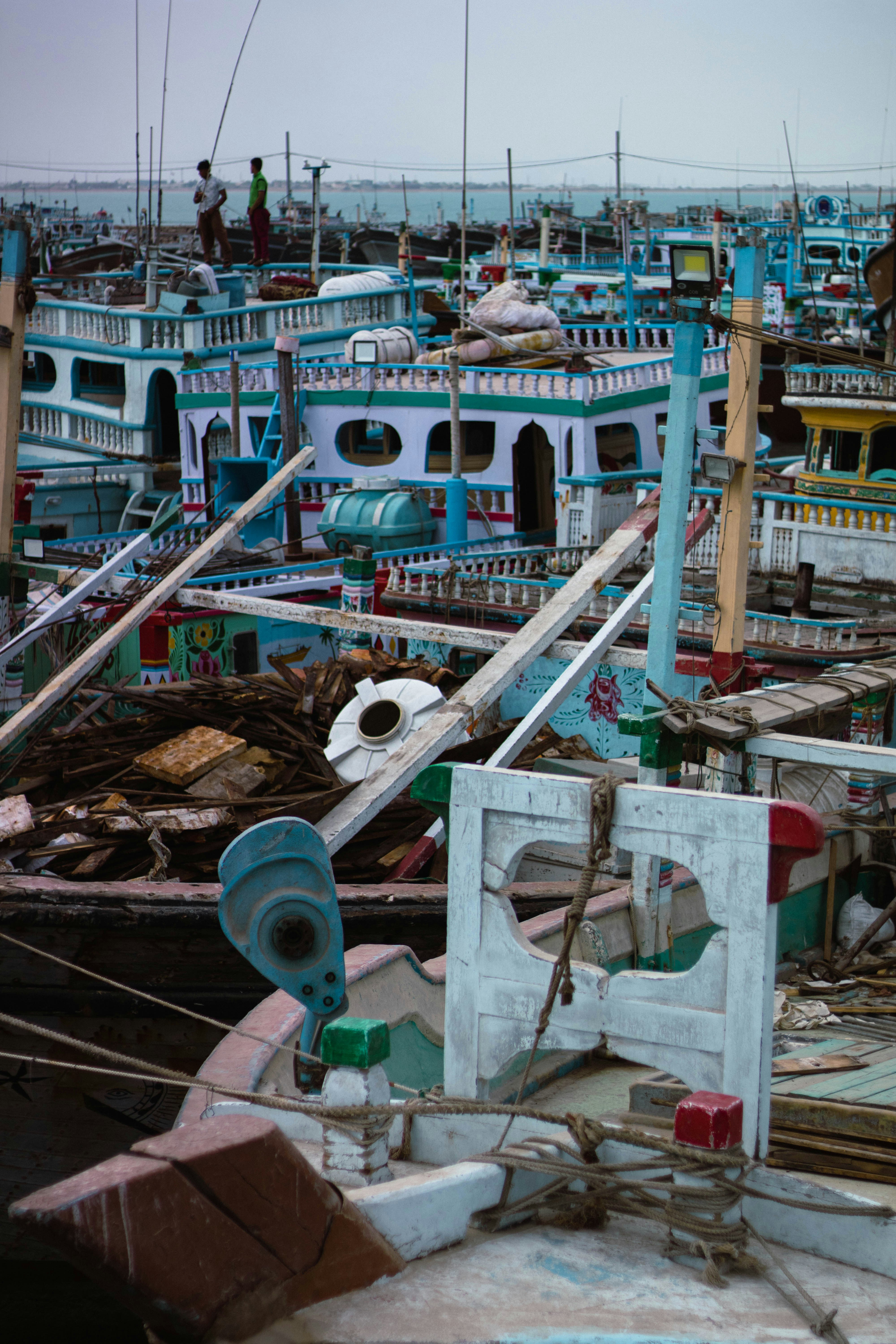 Many colorful boats docked in a harbor.
