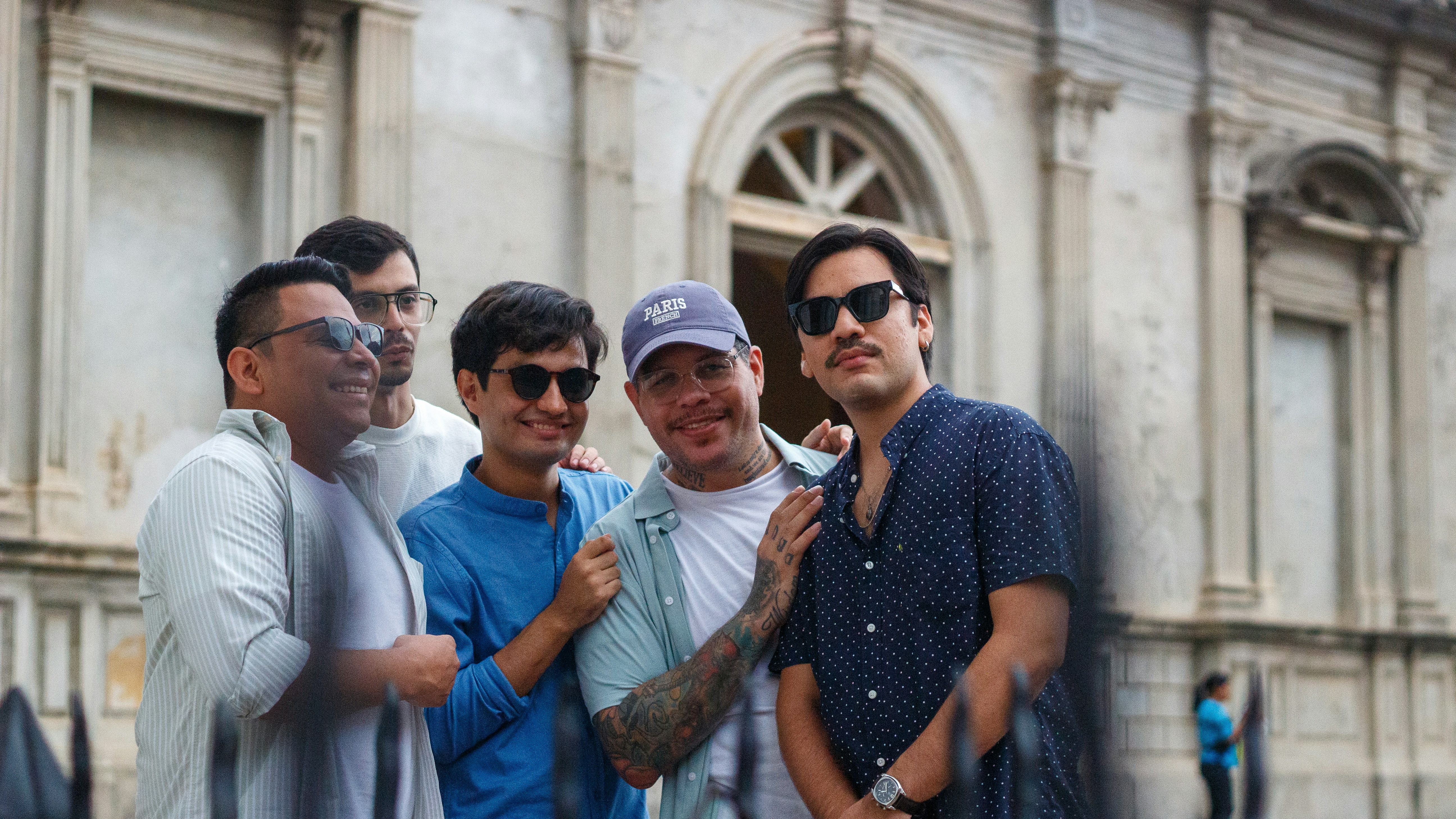 Five Friends Under a Grand Facade: A Casual Street Portrait
