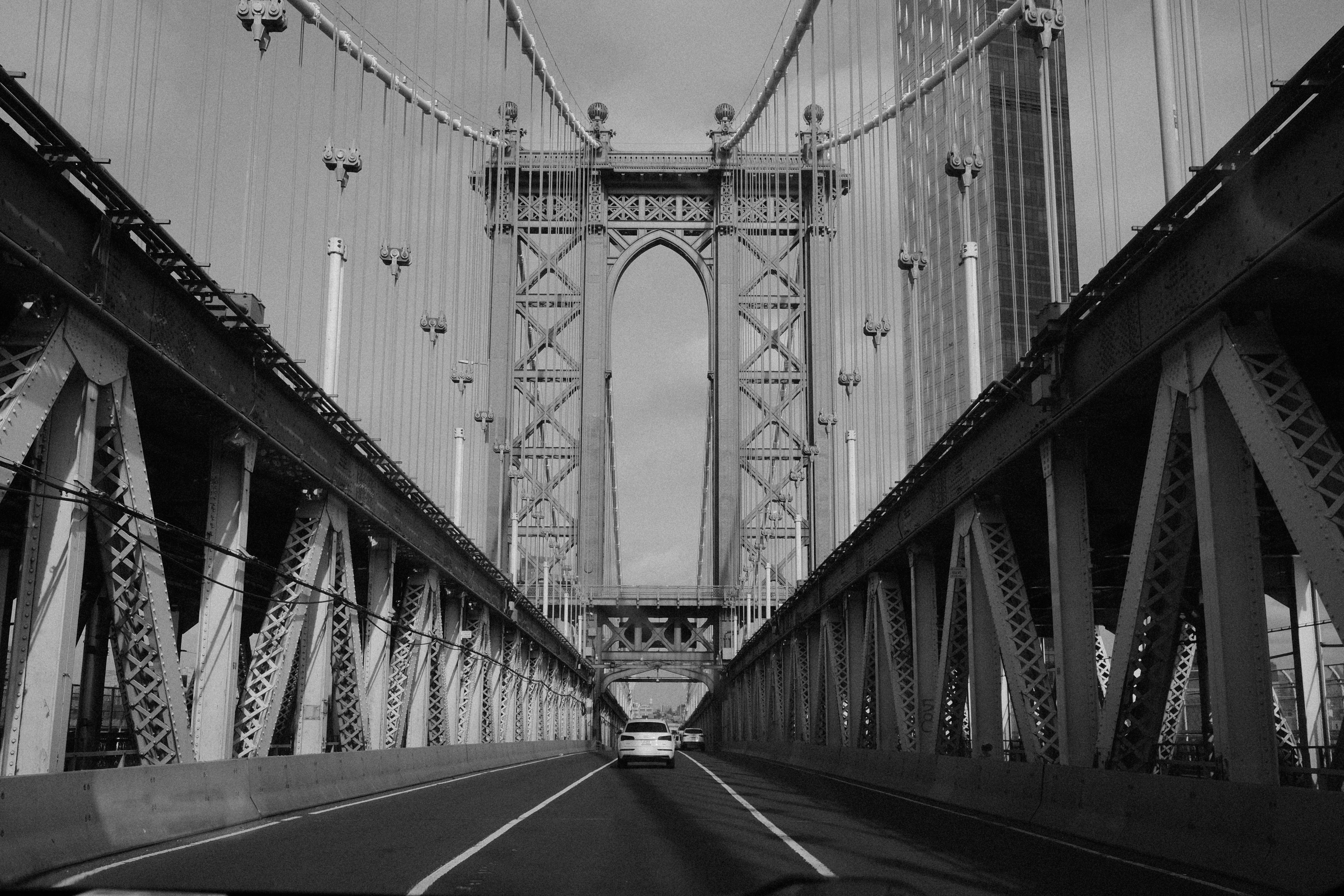 Black and white view of a large suspension bridge