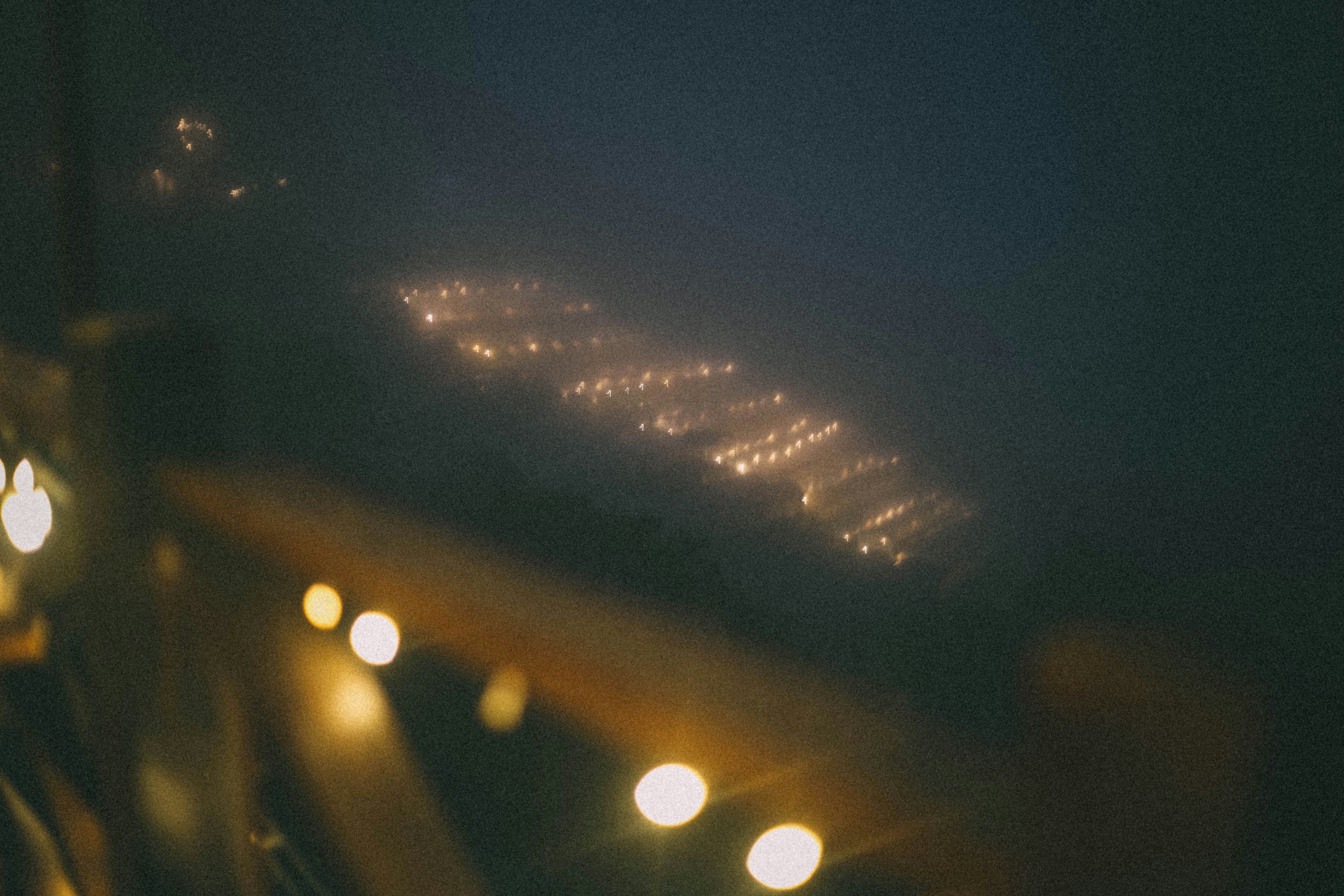 Amber Cascade on a Quiet Balcony: A Night of Subtle Bokeh