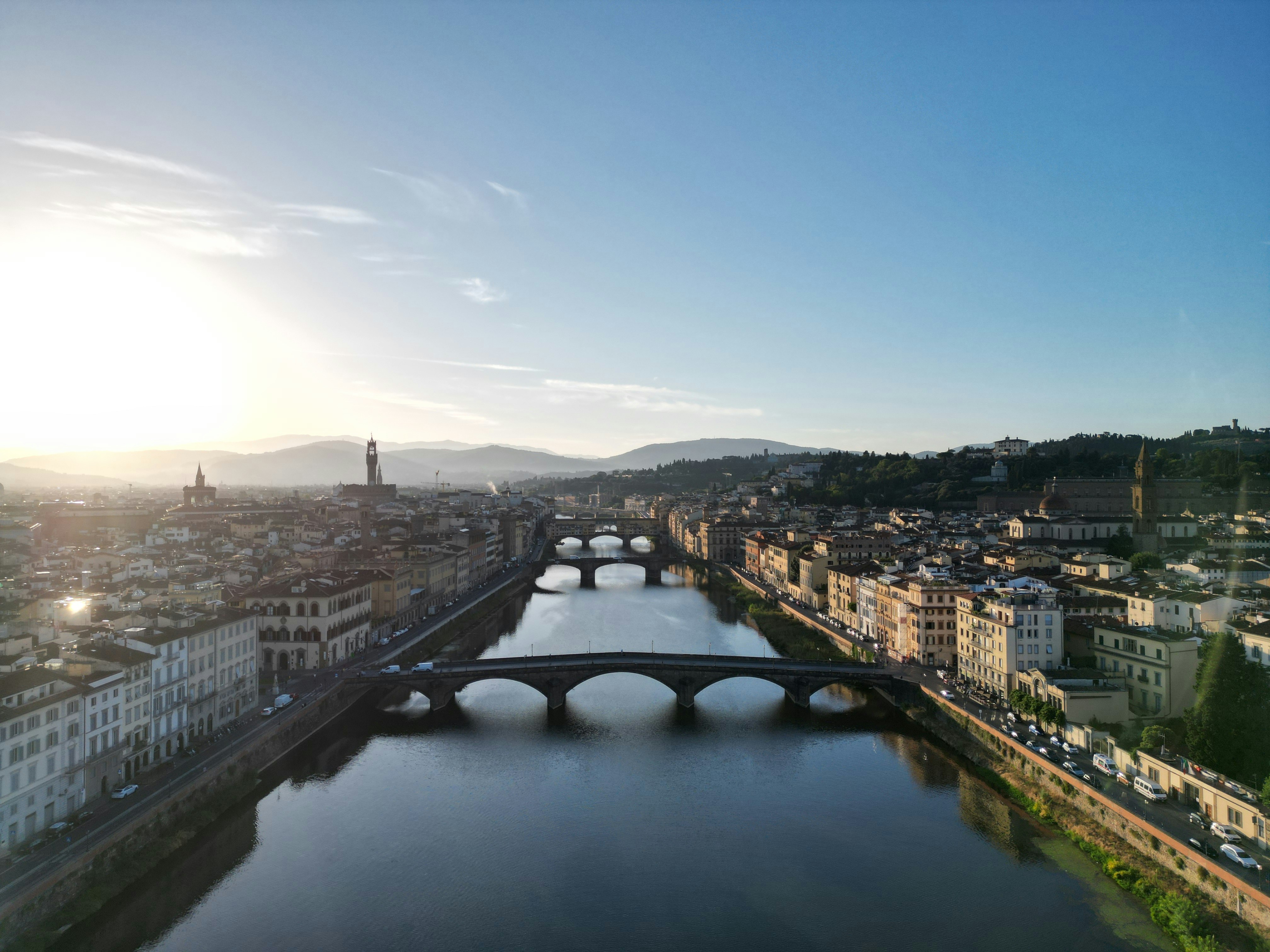 Arno river and bridges in florence, italy at sunset.