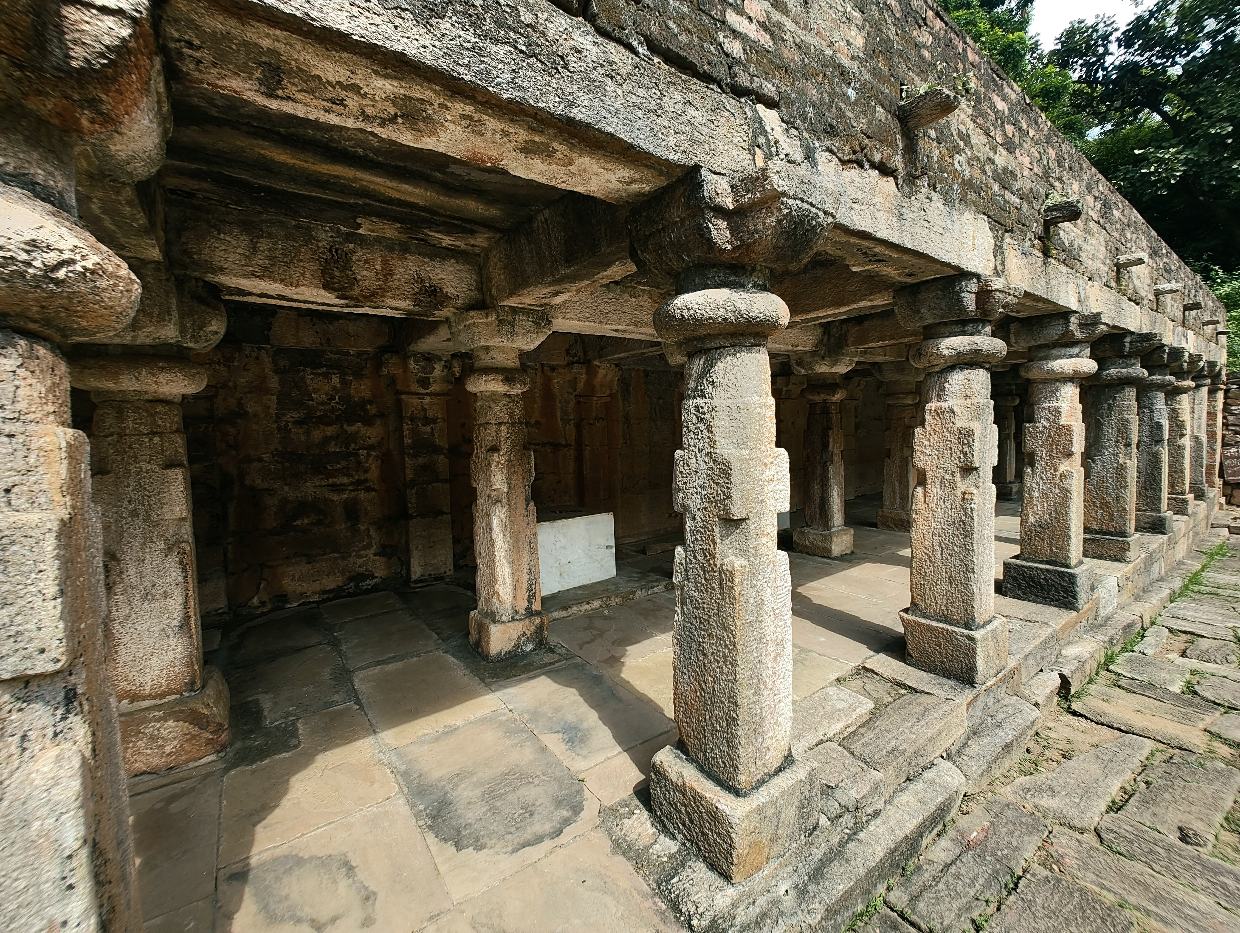 Ancient stone pillars supporting a historic structure