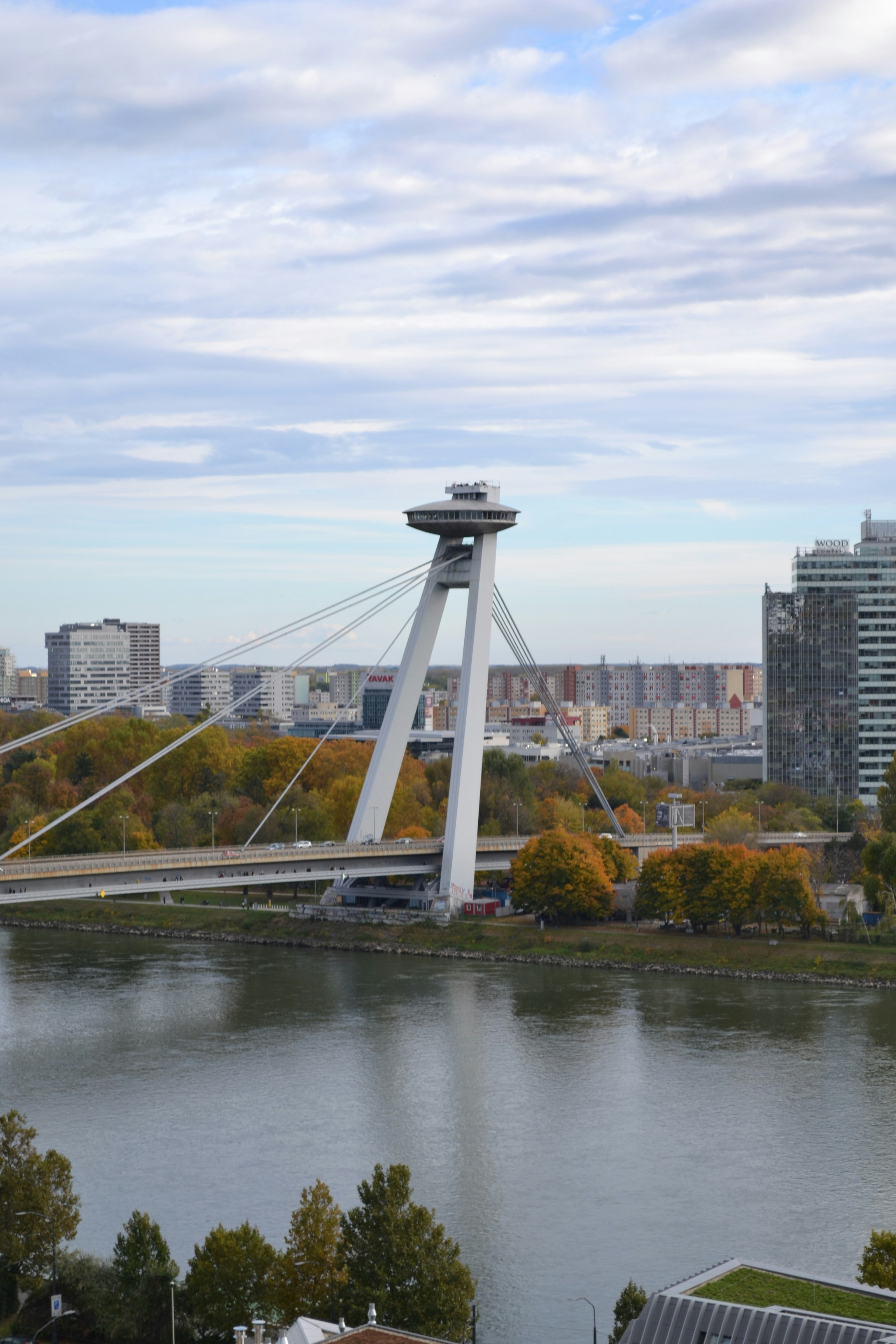 Bridge Tower in Autumn Light: A Riverside Cityscape