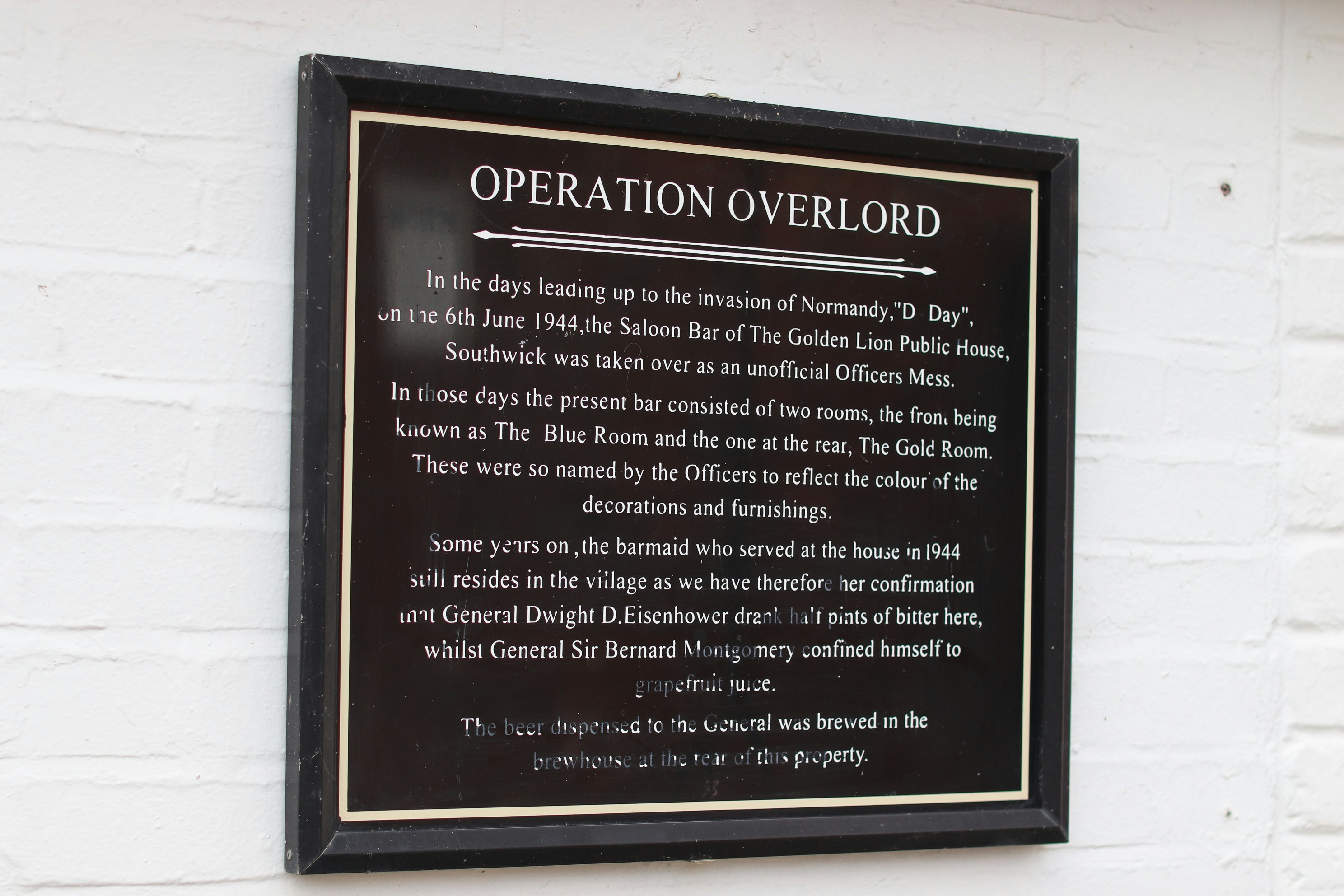 Operation Overlord Plaque: A Quiet D-Day Chronicle on a White Wall